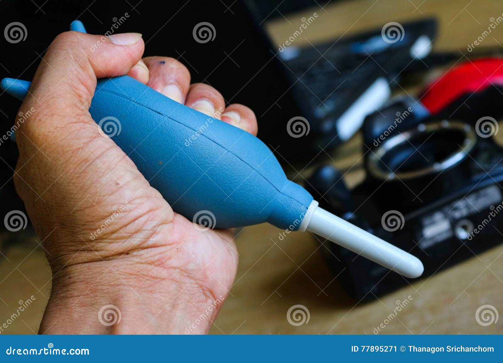 A Hand with the Air Blower is Cleaning the Camera. Stock Image - Image ...