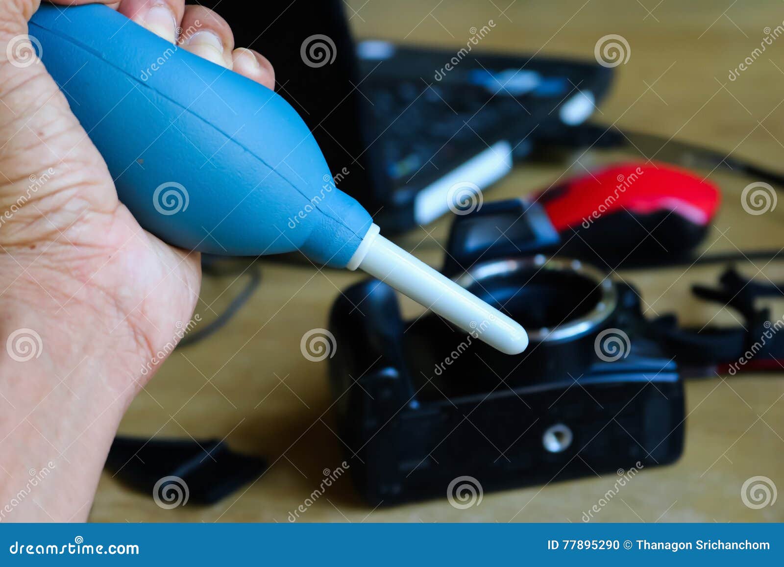 A Hand with the Air Blower is Cleaning the Camera. Stock Photo - Image ...