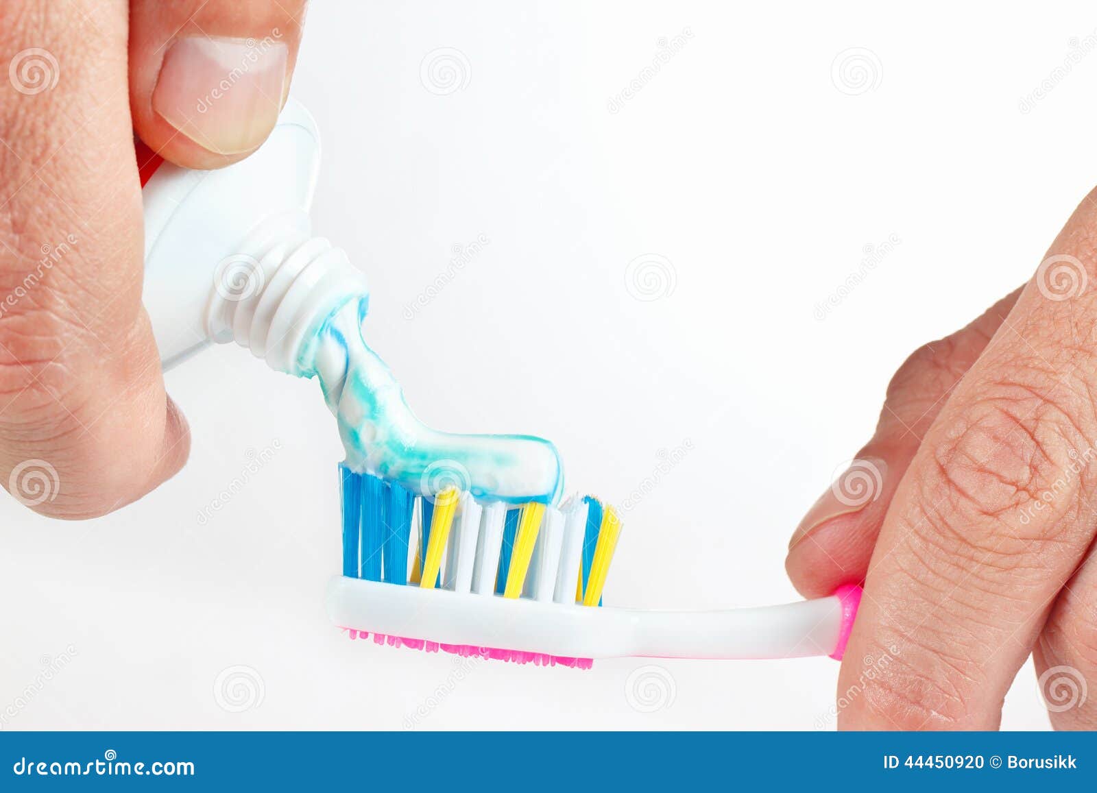 Hand Applied the Color Toothpaste on the Toothbrush on White Background ...