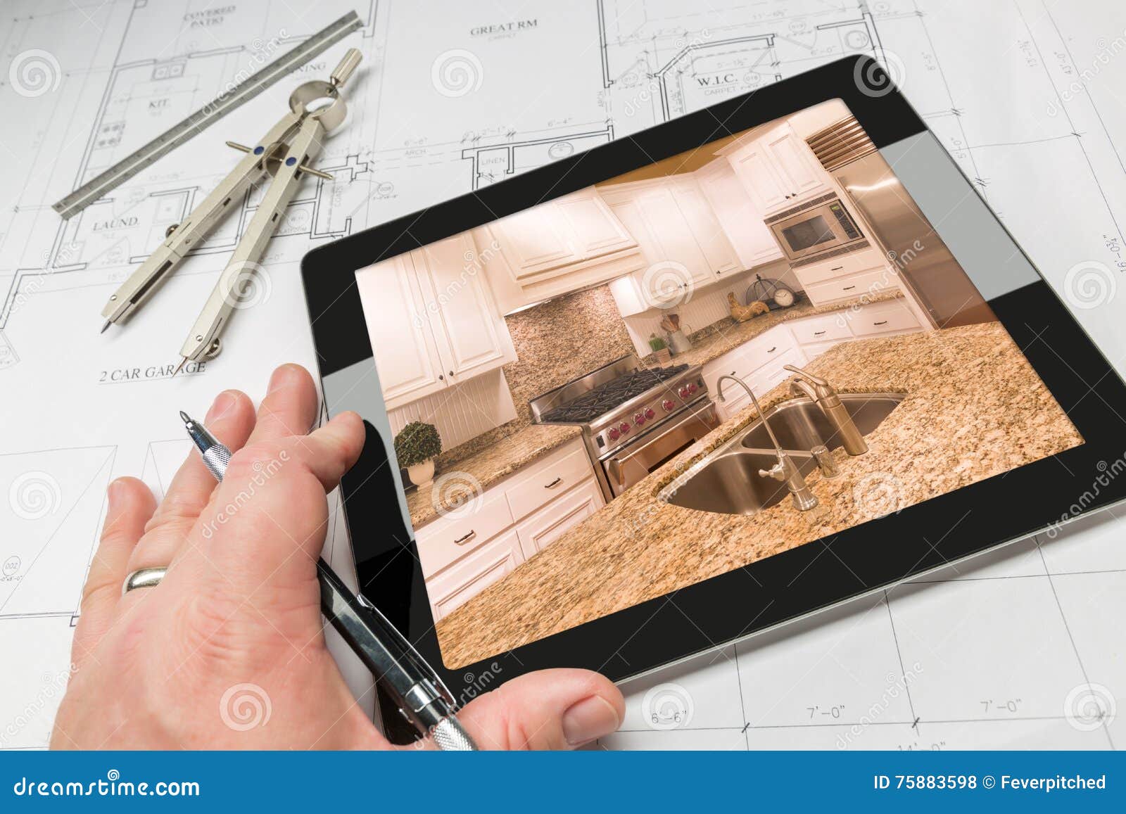 Hand of Architect on Computer Tablet Showing Kitchen Photo Over Stock ...
