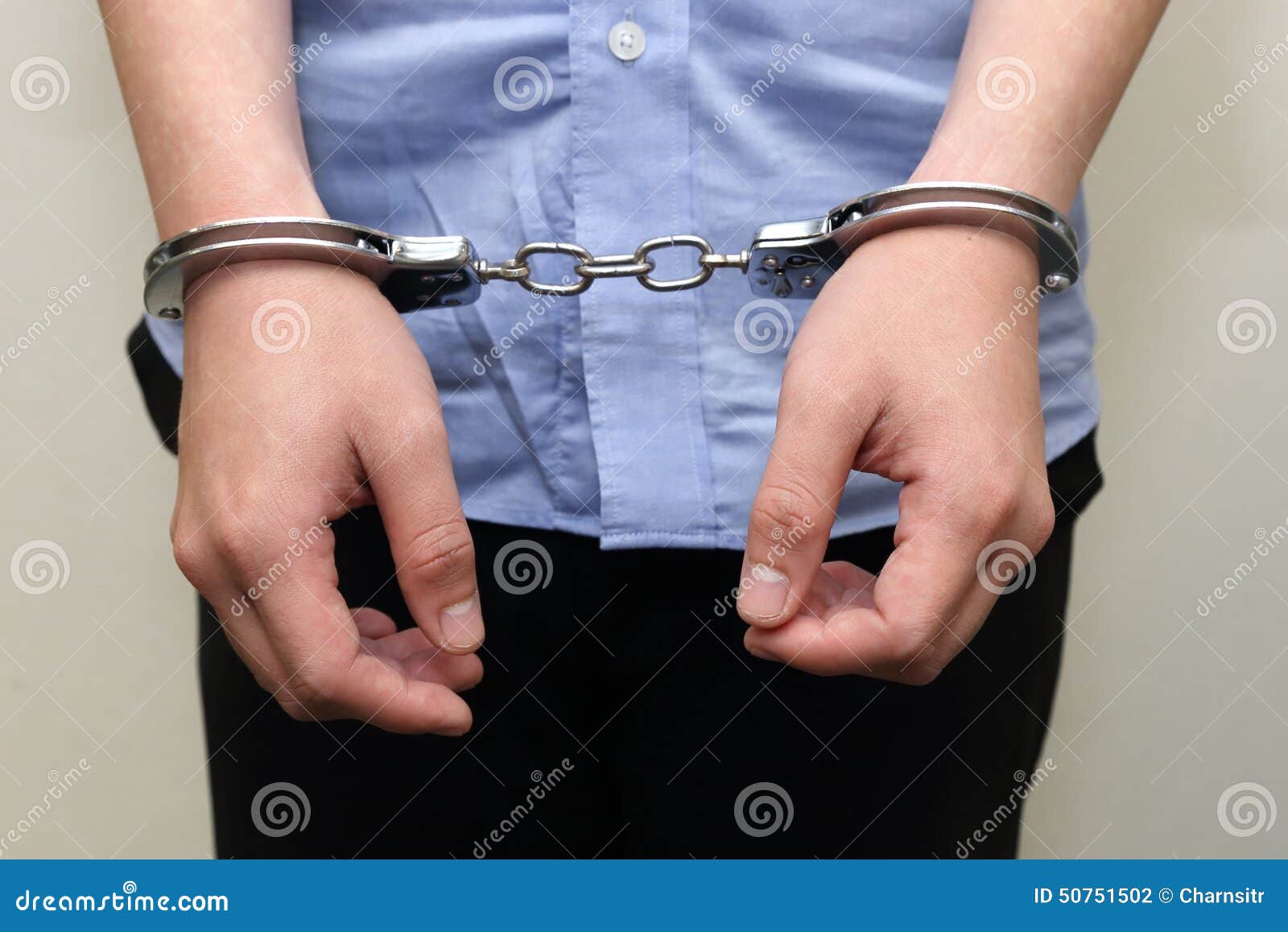 Hand Arrested with Handcuffs on the Wooden Table Stock Photo - Image of ...