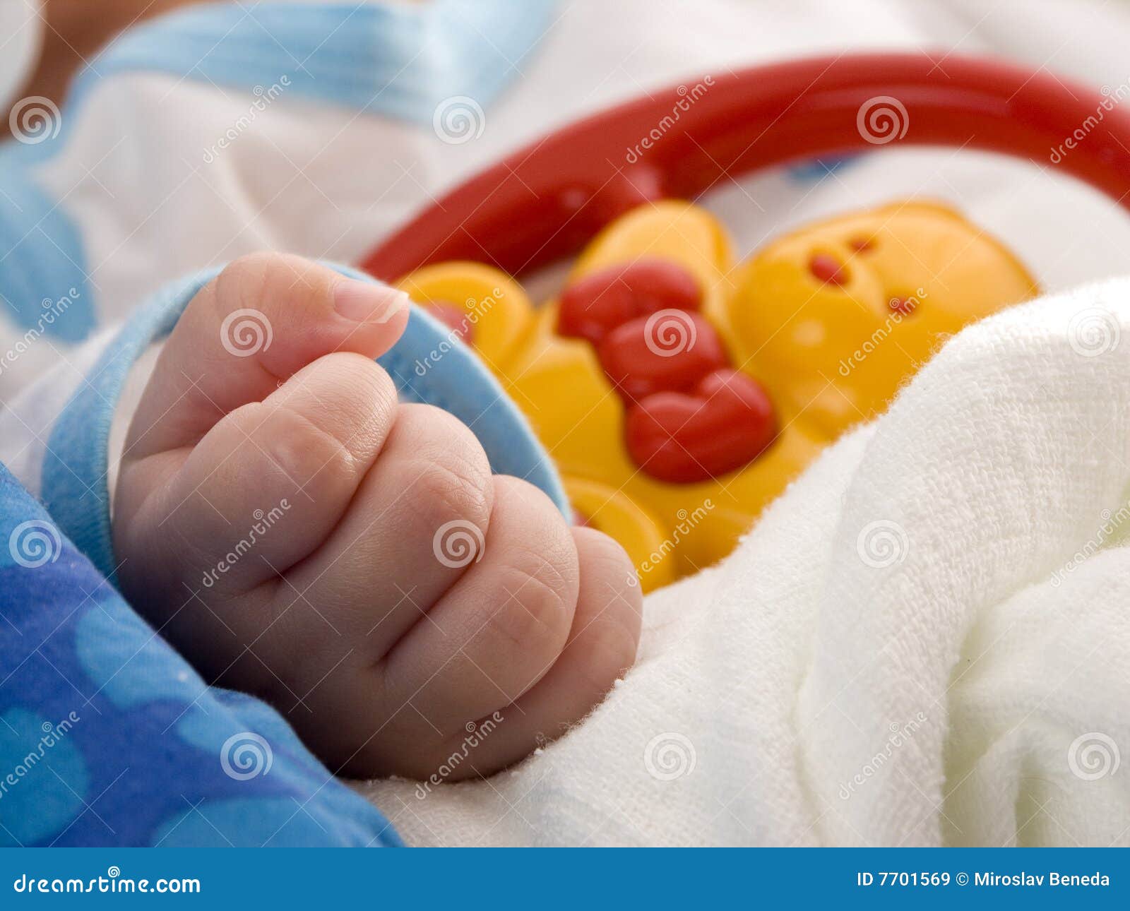 Hand with baby toy stock image. Image of infant, fingernail - 7701569