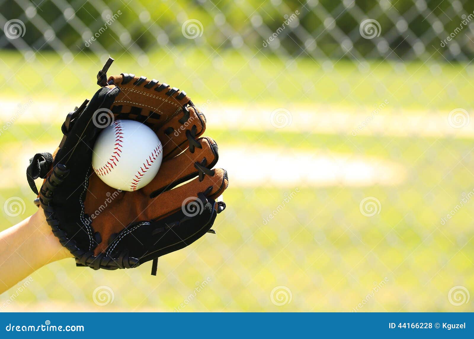Hand of Baseball Player with Glove and Ball Over Field Stock Photo ...
