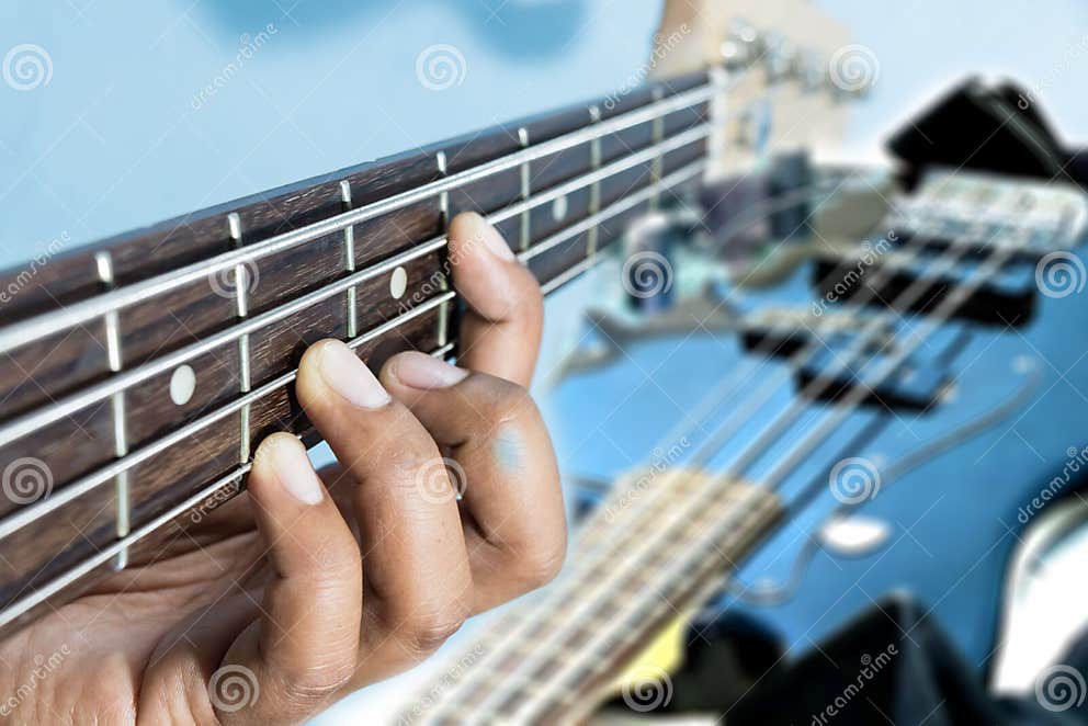 Hand on bass guitar stock image. Image of black, guitar - 107862147