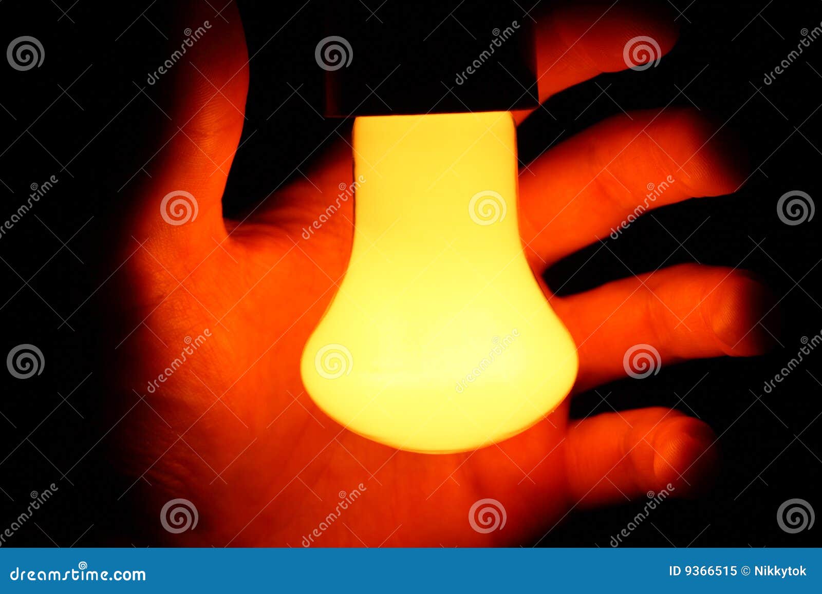 Hand behind the bulb lamp stock image. Image of light - 9366515