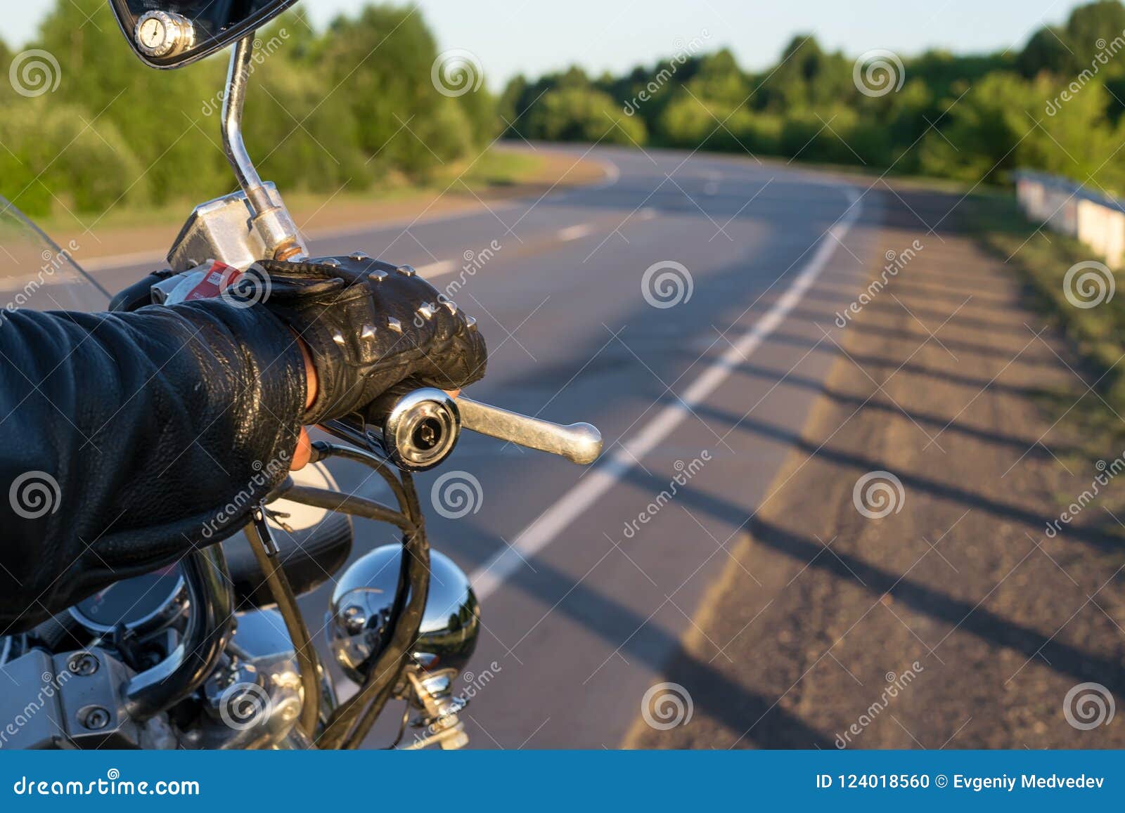 The Hand of the Biker on the Control Handle of the Motorcycle and the ...
