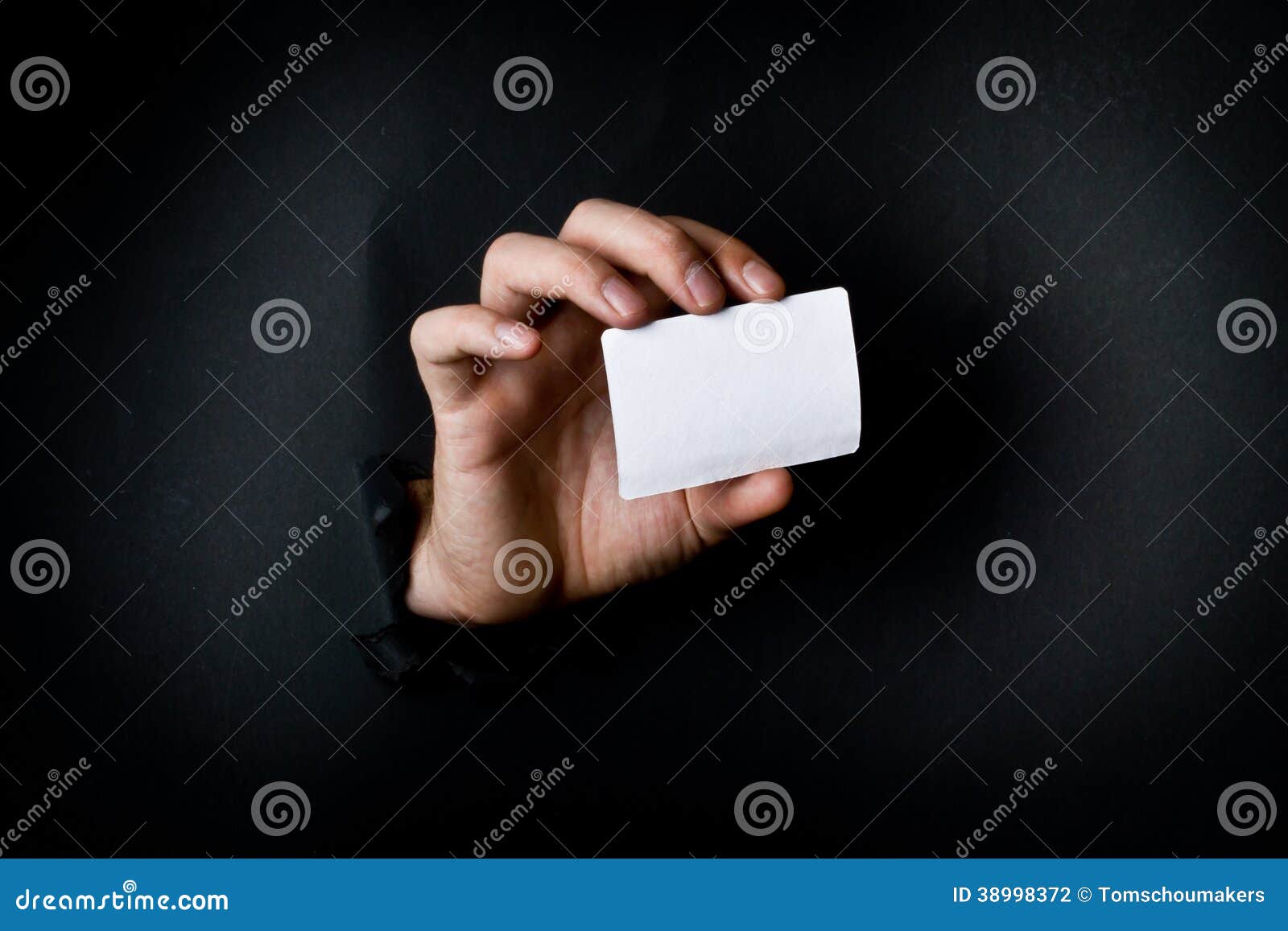 Hand through black paper stock photo. Image of person - 38998372