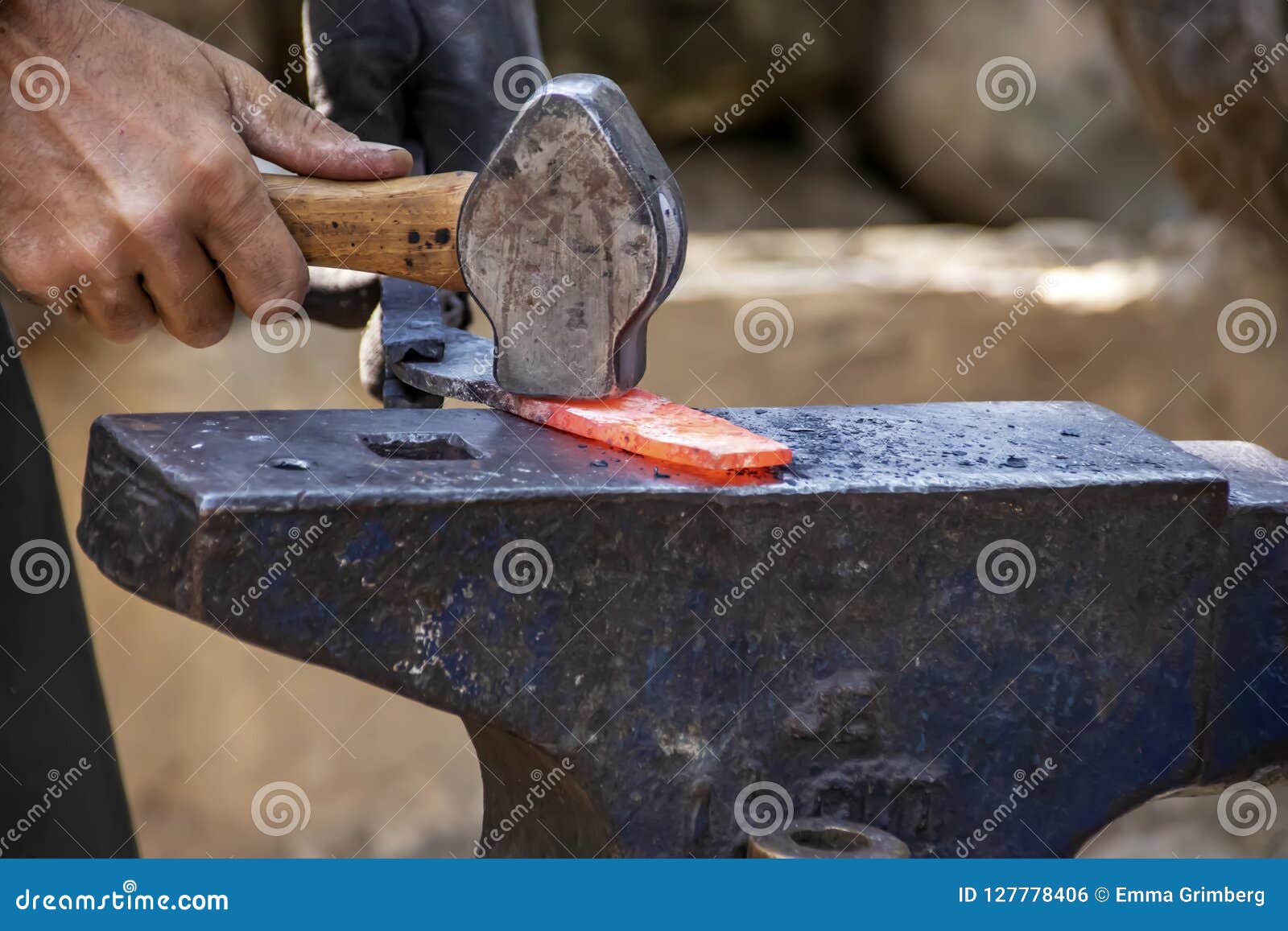 The Hand of a Blacksmith with a Hammer Stock Photo - Image of steel ...