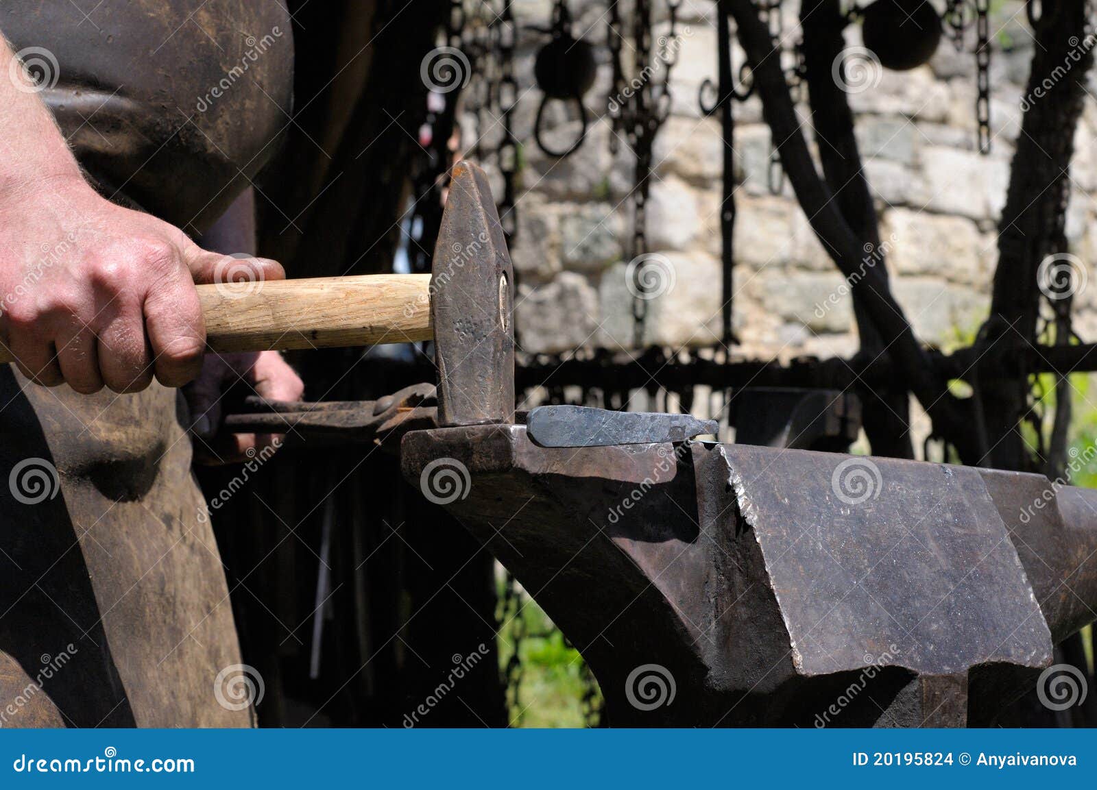 Hand of blacksmith at work stock photo. Image of industry - 20195824