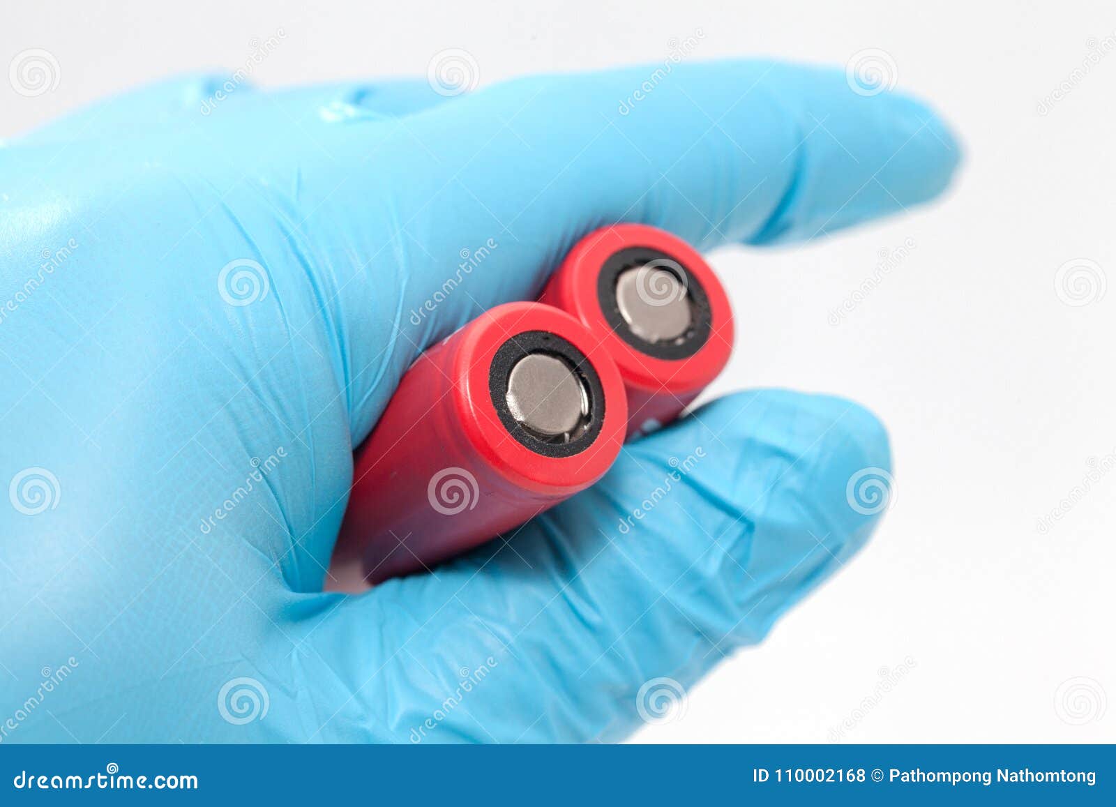 Hand in Blue Glove Holding Battery Stock Photo - Image of hold, holding ...