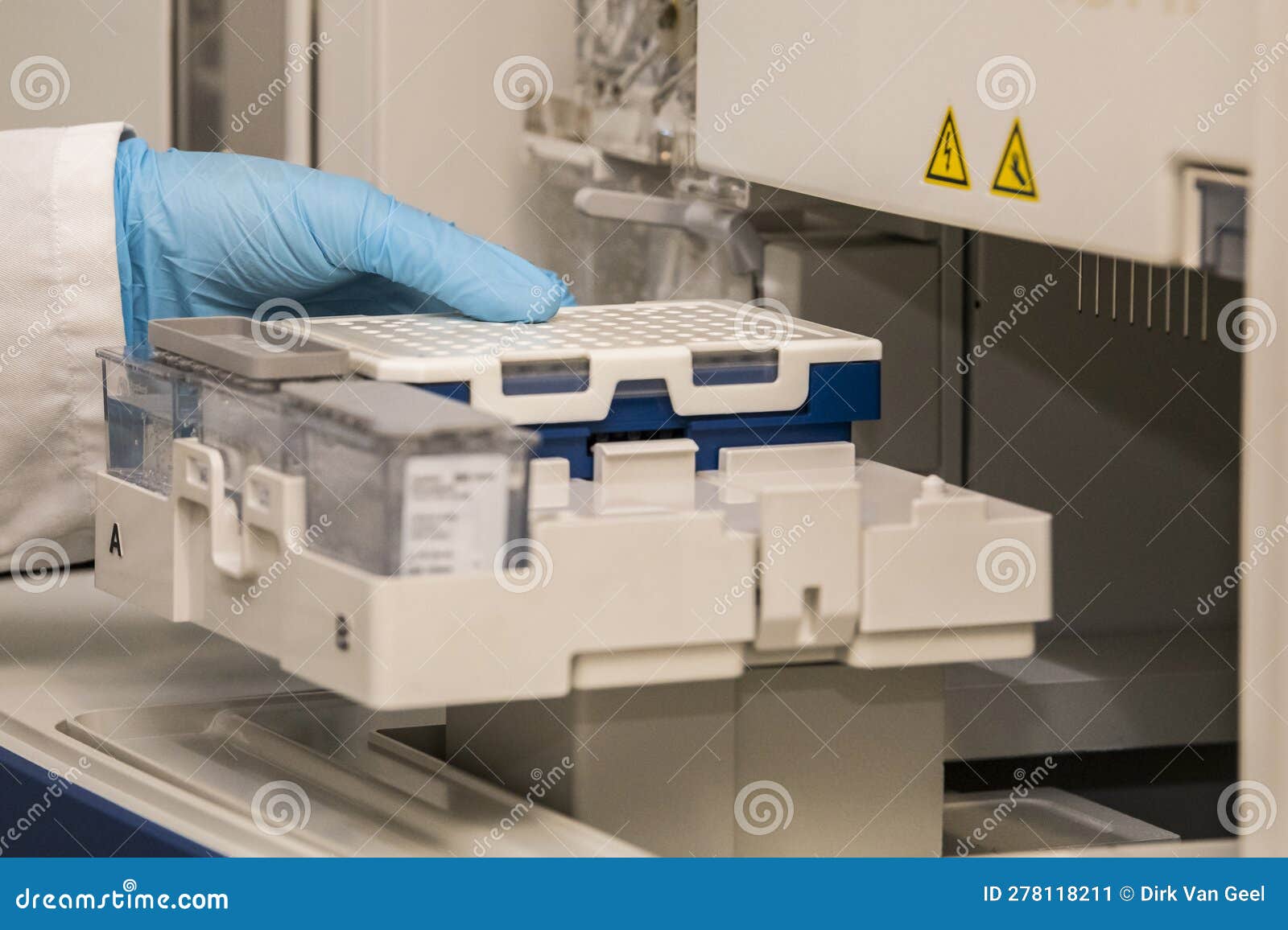 A Hand with Blue Nitril Gloves Puting a PCR Plate into a Sanger Genetic ...