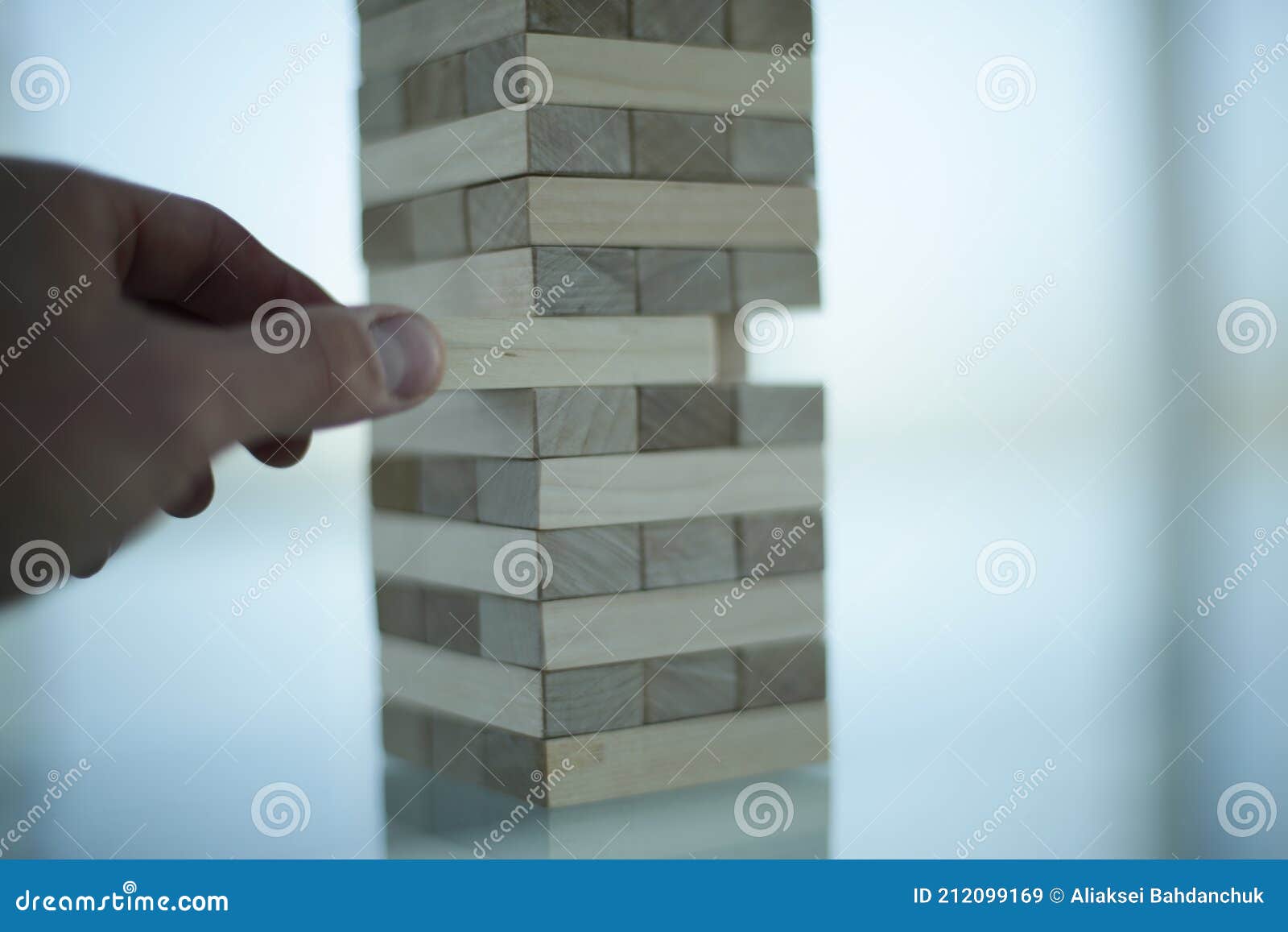 Hand, Board Game - Wooden Bars on a Glass Table Stock Image - Image of ...