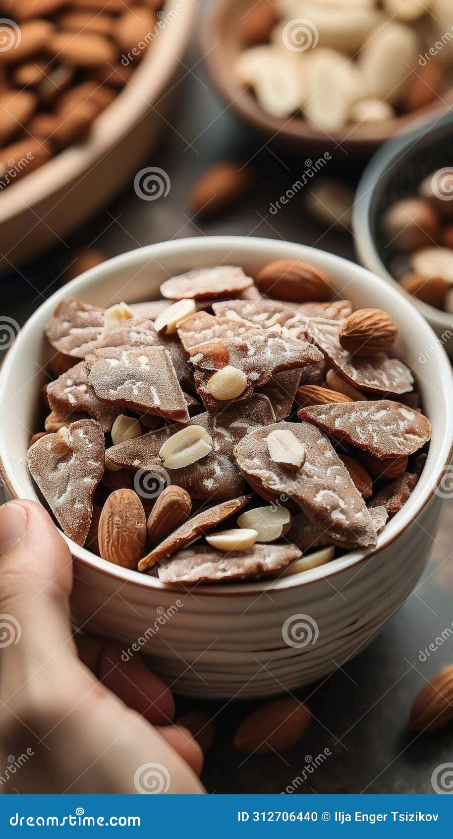 Hand Breaking Peanut Brittle, Showcasing Crunchy Texture, Shattered ...