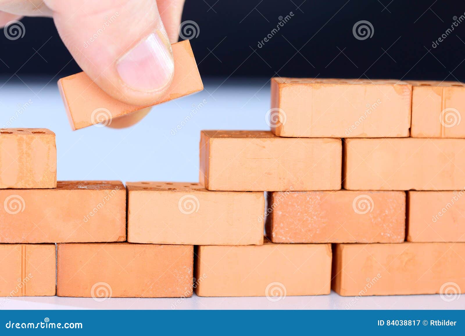 Hand and brick stock image. Image of material, industrial - 84038817
