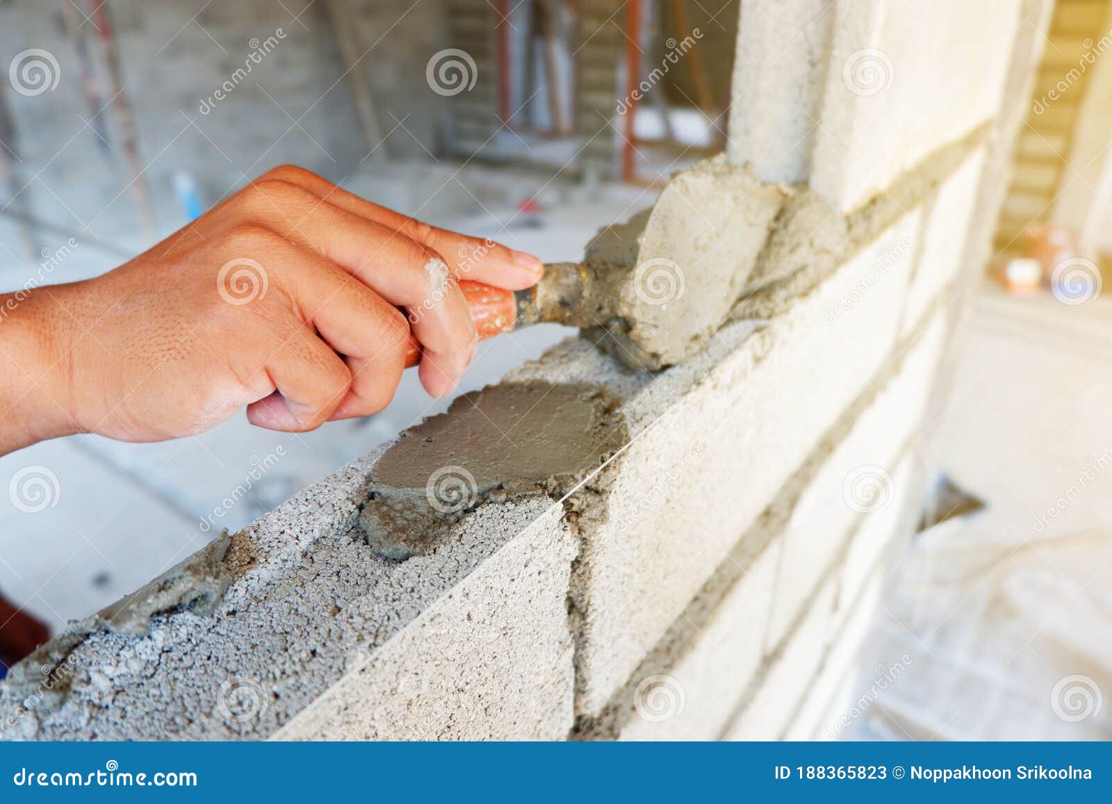 Hand of Bricklayer is Working for Wall Construction with Cement Brick ...