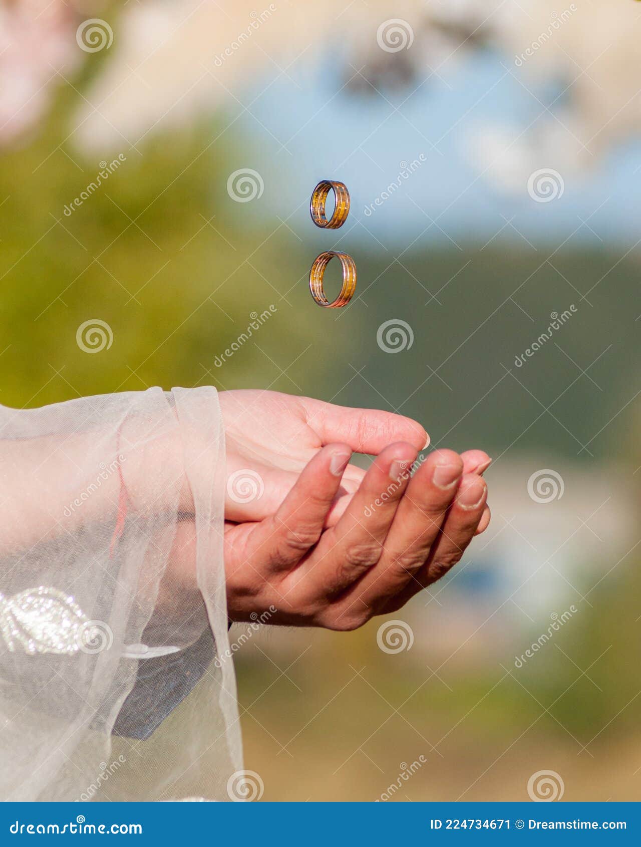 Falling wedding rings stock image. Image of husband - 224734671