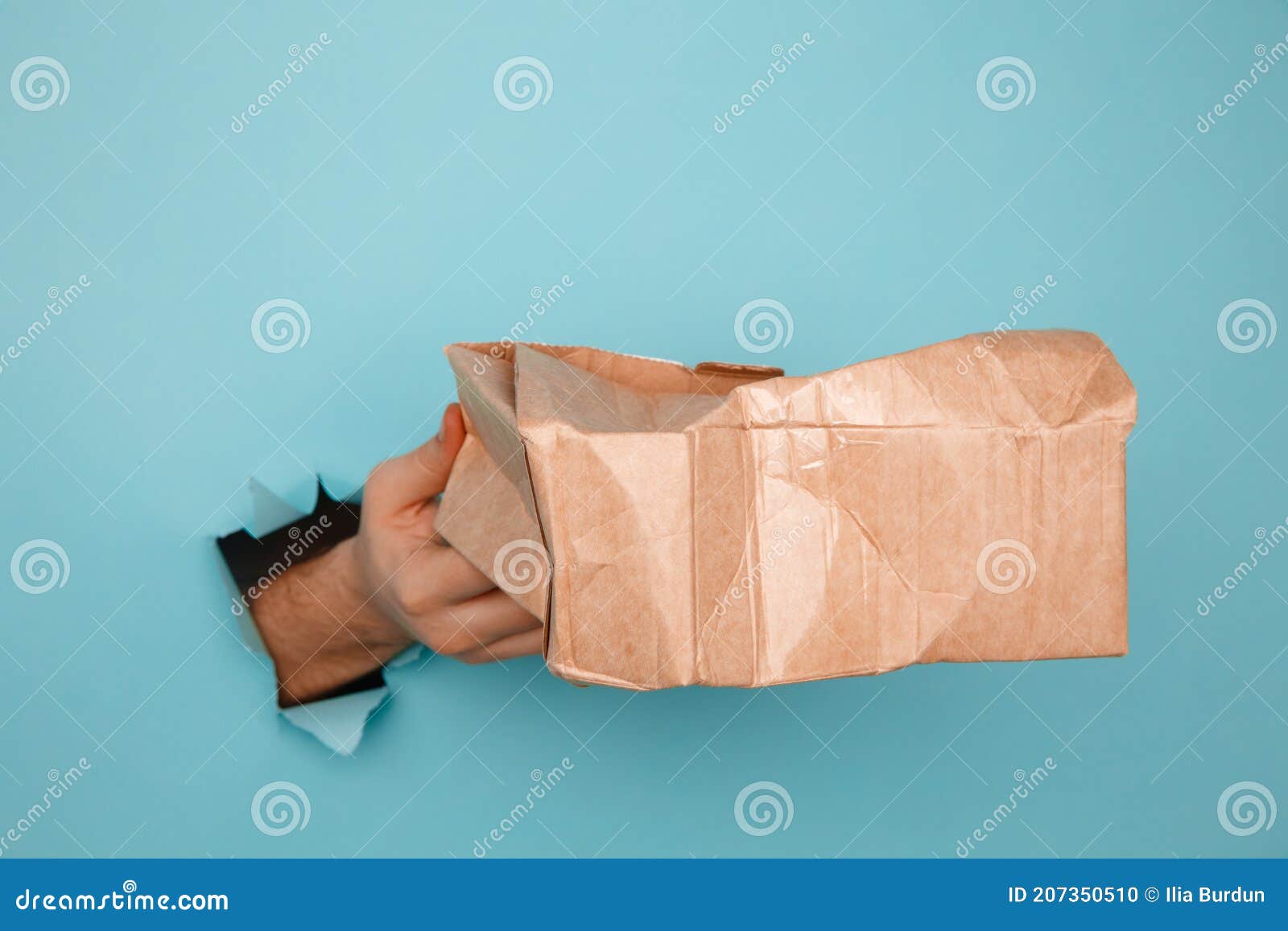 Hand with a Broken Delivery Box through a Paper Hole. Shipment& X27;s ...