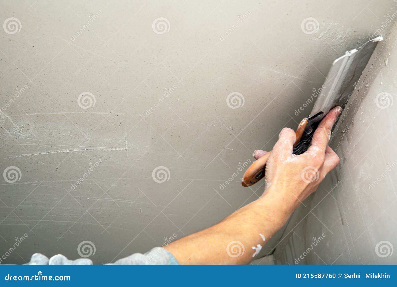Hand of Builder Worker Spacks Ceiling with Putty Plaster Aligning ...
