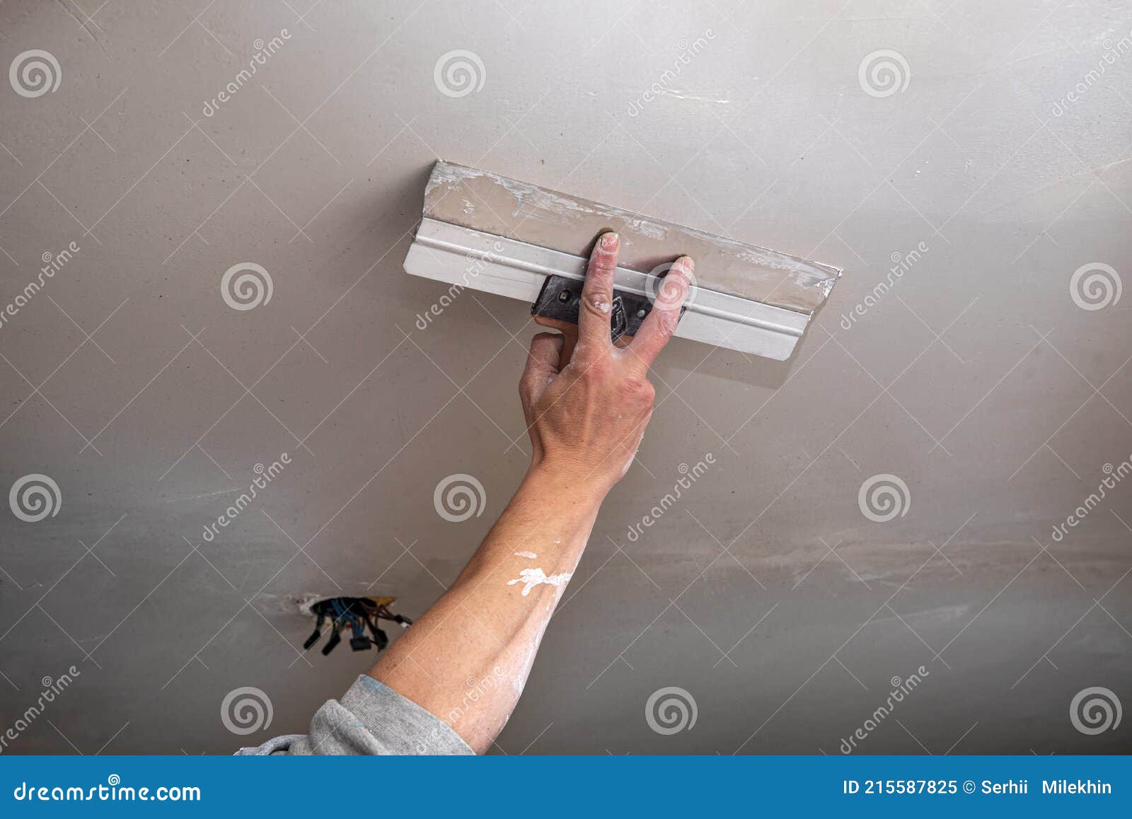 Hand of Builder Worker Spacks Ceiling with Putty Plaster Aligning ...