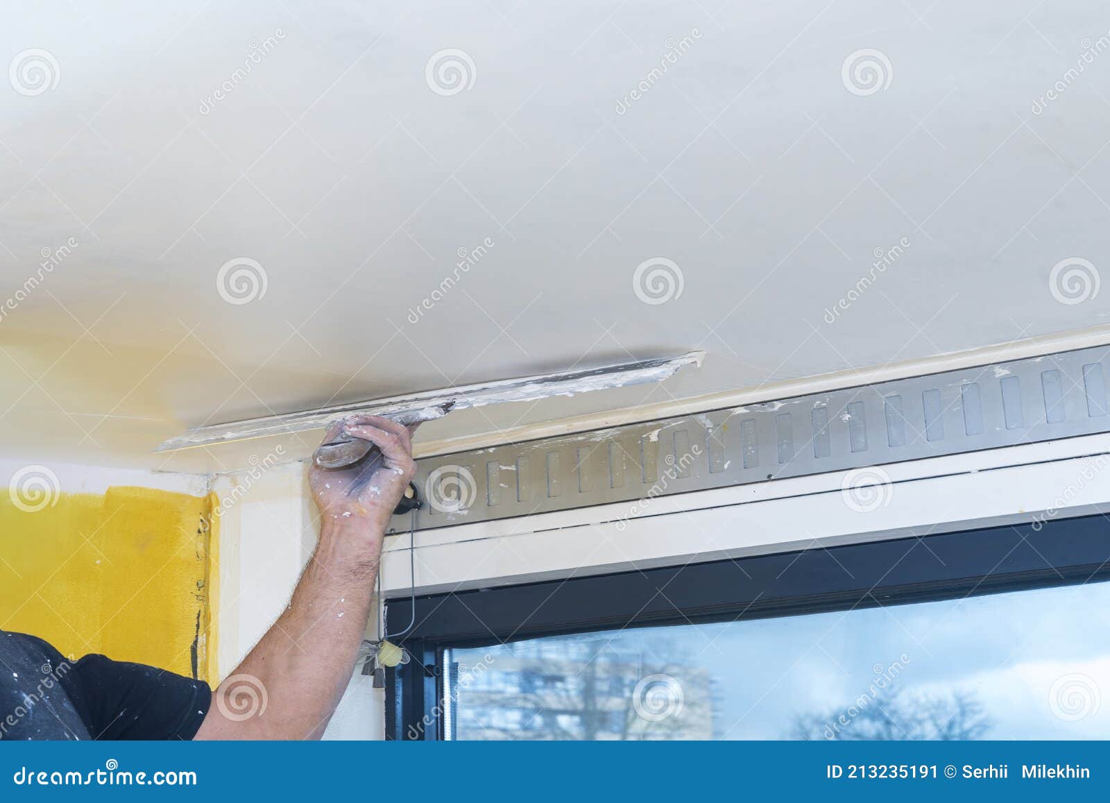 Hand of Builder Worker Spacks Ceiling with Putty Plaster Aligning ...
