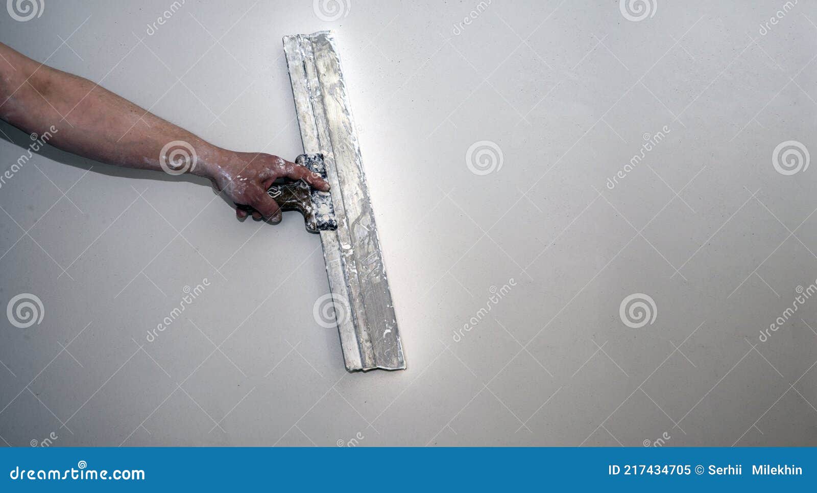 .Hand of Builder Worker Spacks Wall with Putty Plaster Aligning ...