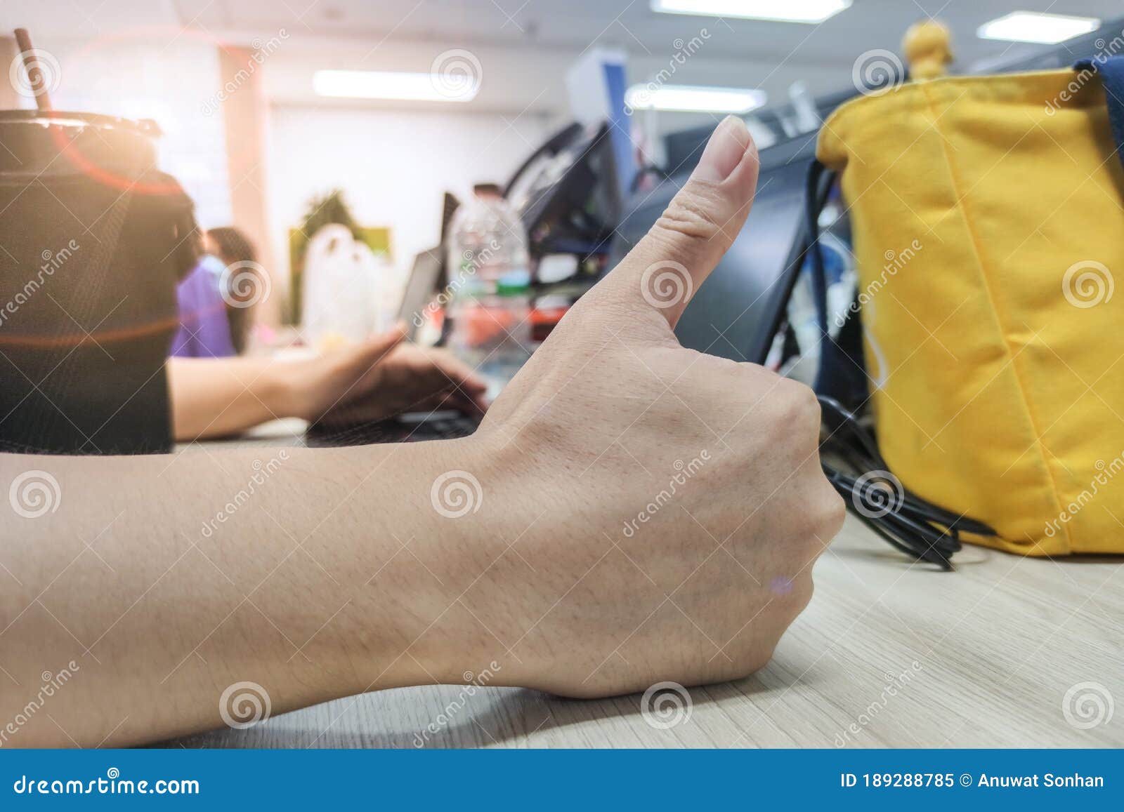 The Hand of the Business Man Who Thumbs Up on the Table Stock Image ...