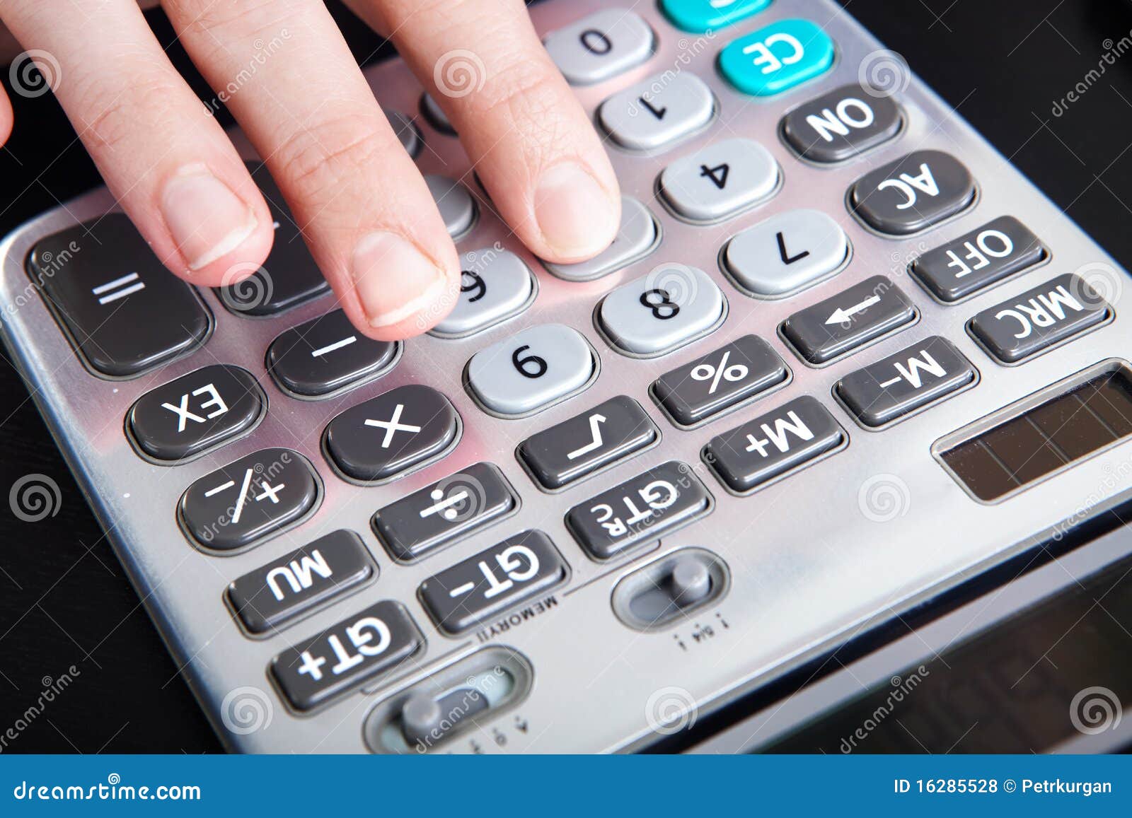 Hand on a calculator stock photo. Image of woman, table - 16285528