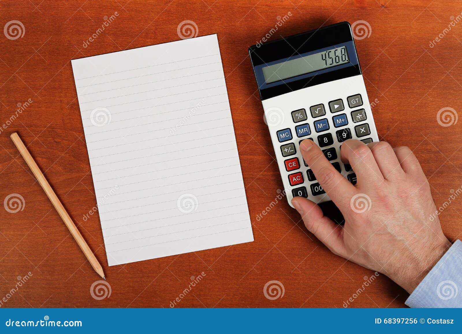 Hand on calculator stock photo. Image of desk, business - 68397256