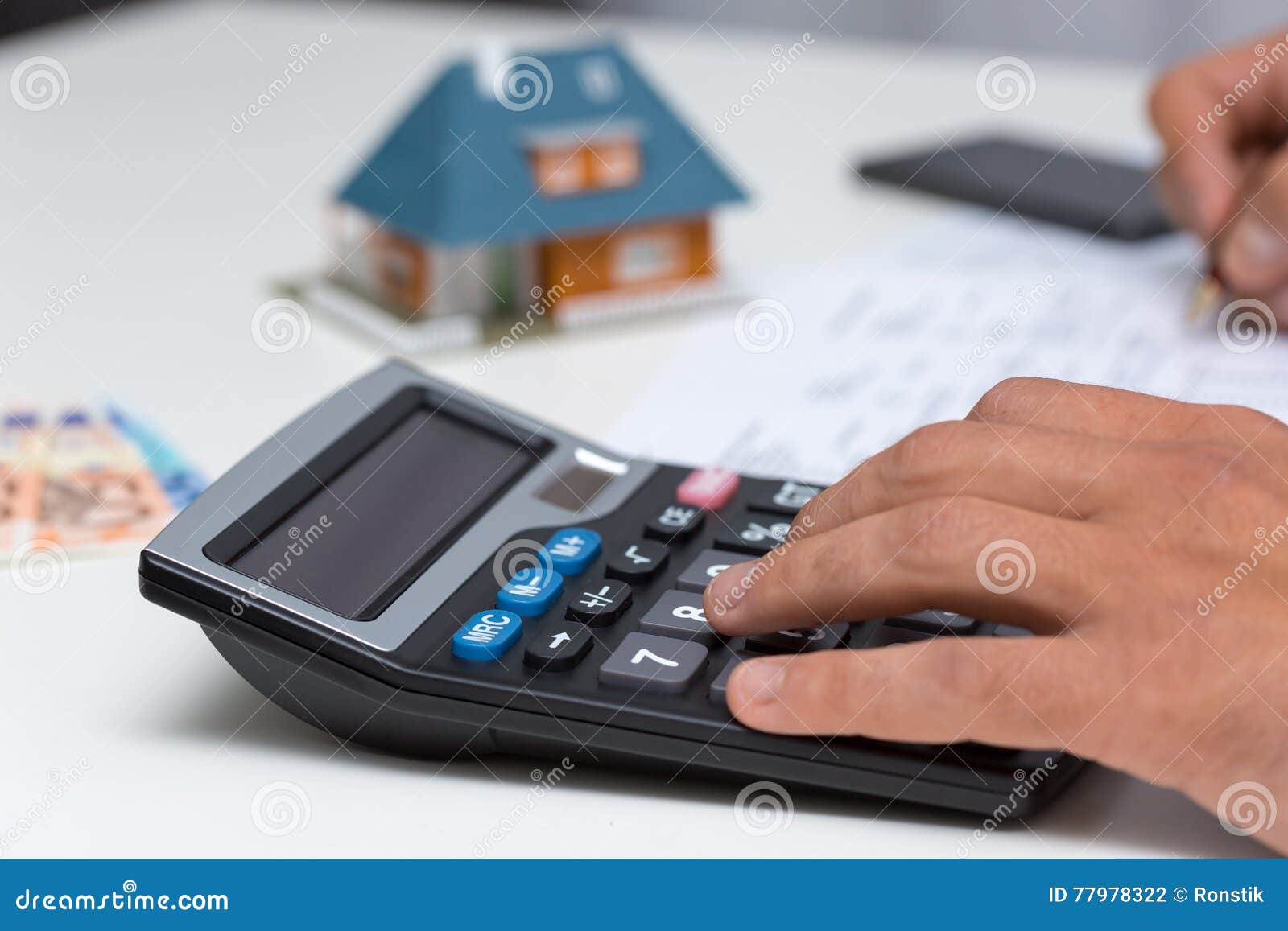 Hand on Calculator - Calculating Household Expenses Stock Photo - Image ...