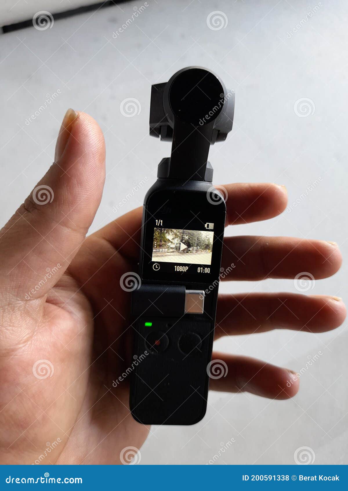Hand camera in hand stock photo. Image of organ, electronics - 200591338