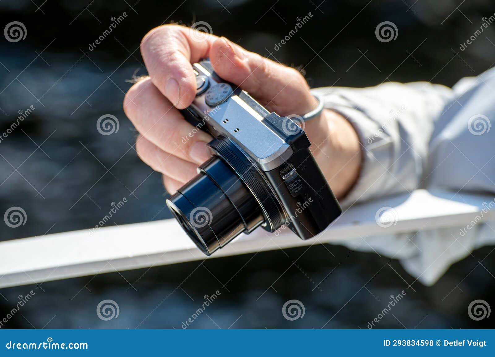 Hand with Camera and Looking at the Display Stock Photo - Image of ...