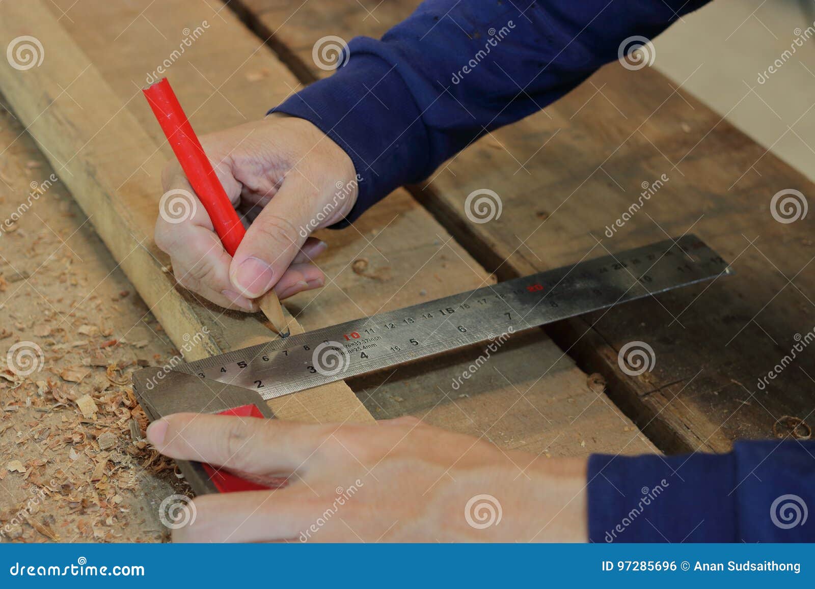 Hand of a Carpenter Taking Measurement on a Wooden Plank in Workshop ...