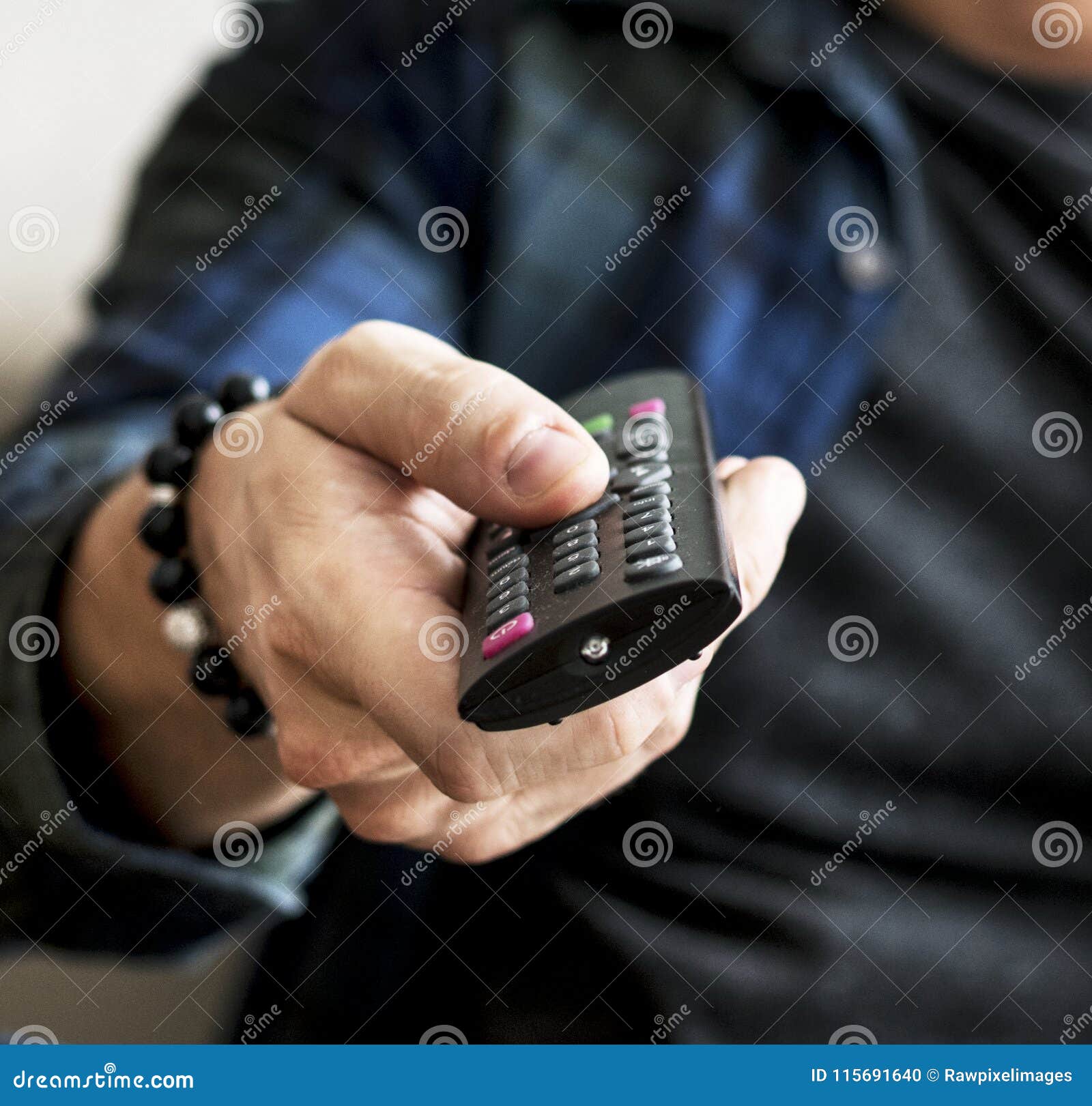 Hand Carrying a Remote Controller Stock Photo - Image of person ...