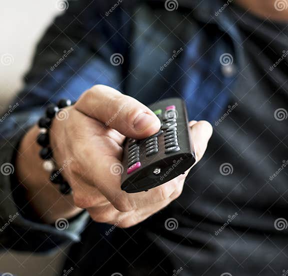Hand Carrying a Remote Controller Stock Photo - Image of person ...