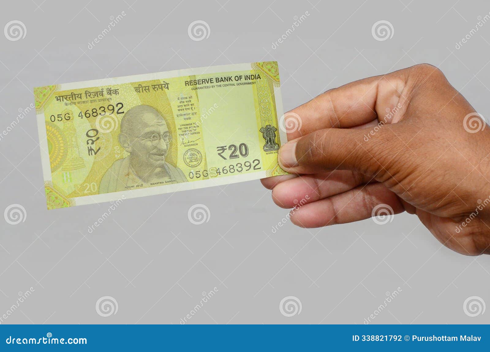 Hand Catch Indian New Currency 20 Rupee Note. Stock Photo - Image of ...