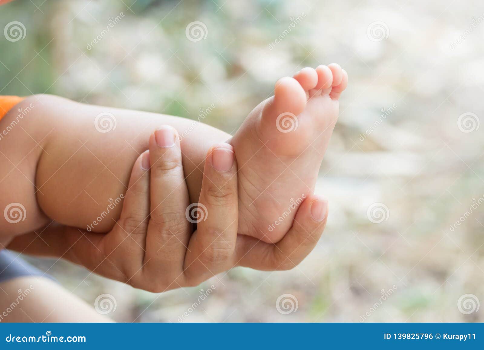 Hand catching foot. stock photo. Image of closeup, body - 139825796