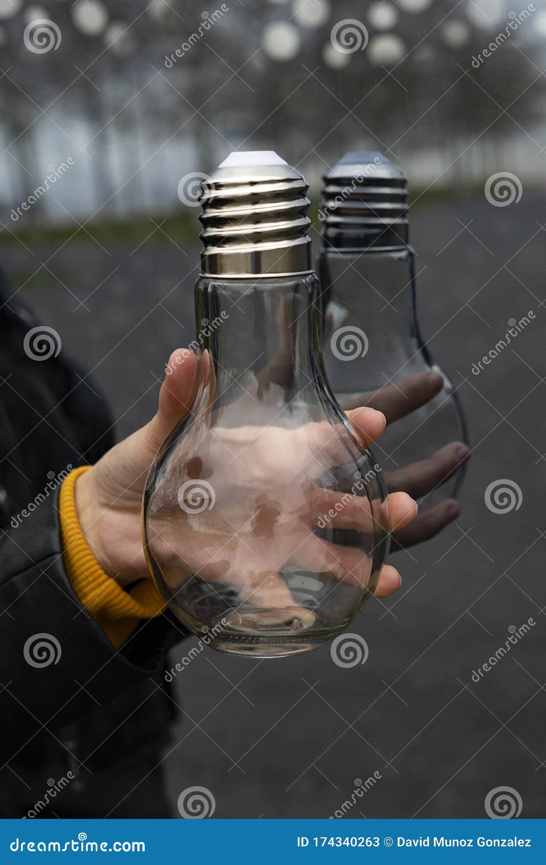 Hand Catching a Light Bulb. Stock Image - Image of light, tube: 174340263