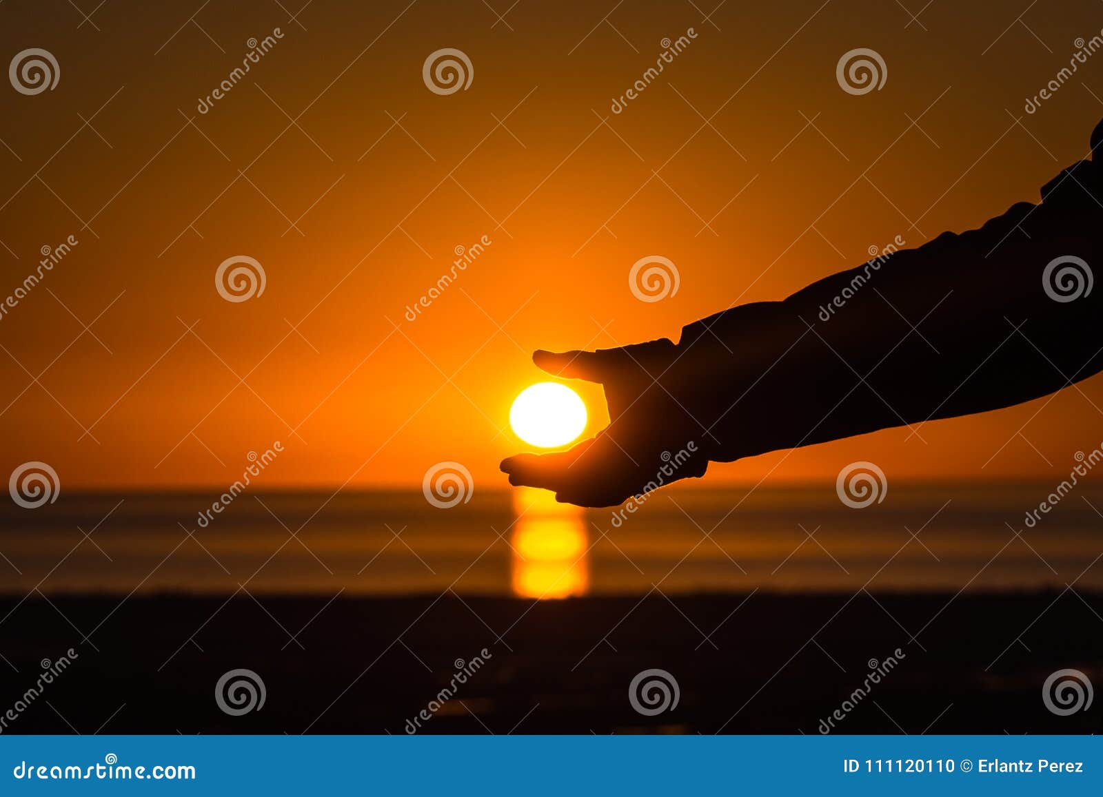 Hand Catching the Sun during the Sunset. Stock Photo - Image of light ...