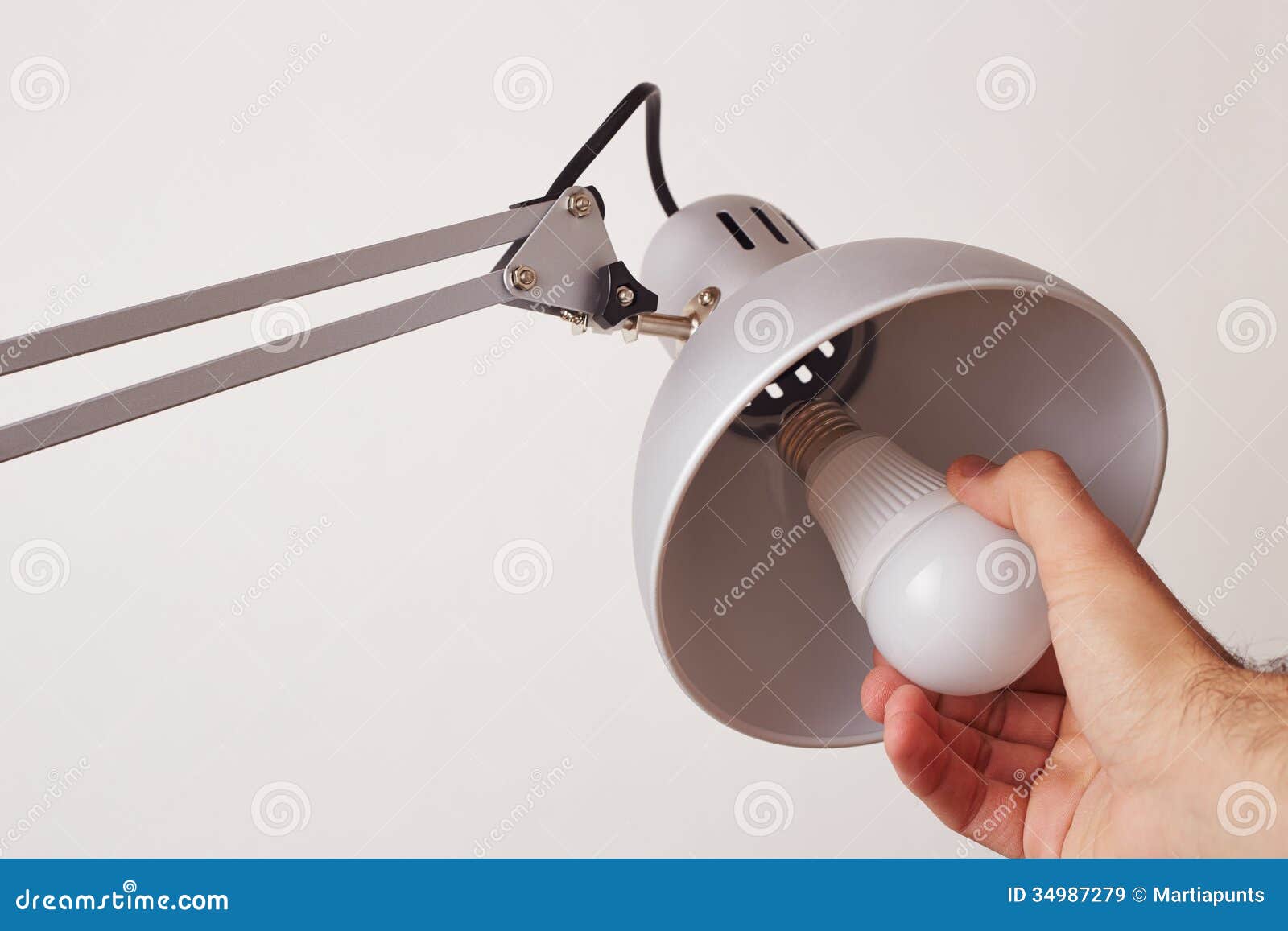 Hand Changing a Regular Light Bulb for LED Stock Image - Image of hand ...