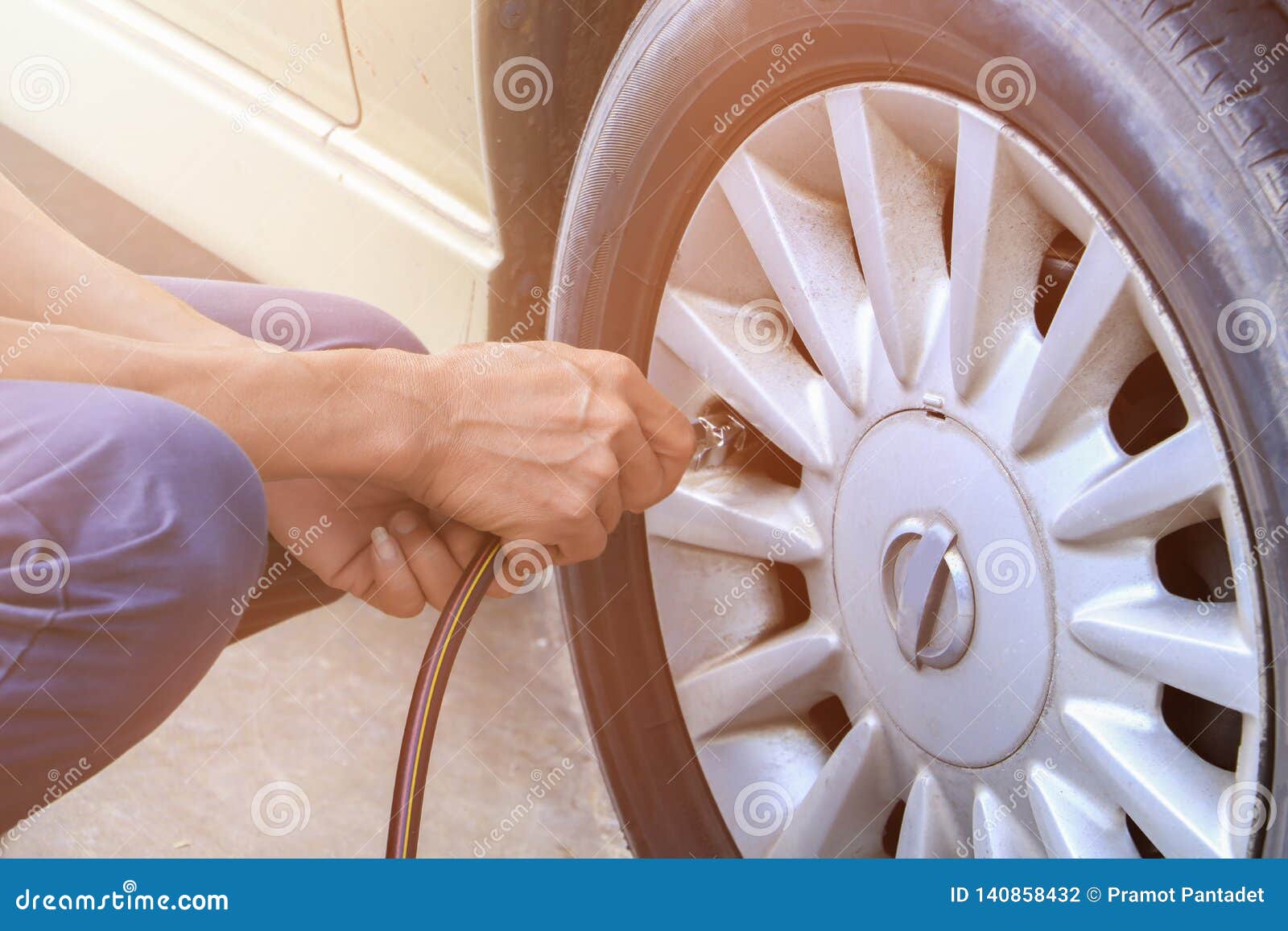 Hand Checking and Filling Air Tire in Old Wheel Stock Photo - Image of ...