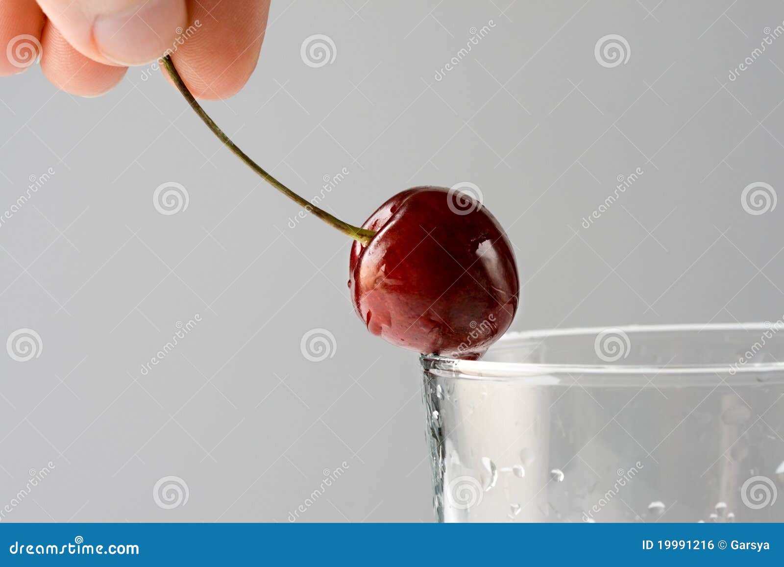 Hand with a cherry stock photo. Image of finger, crimson - 19991216