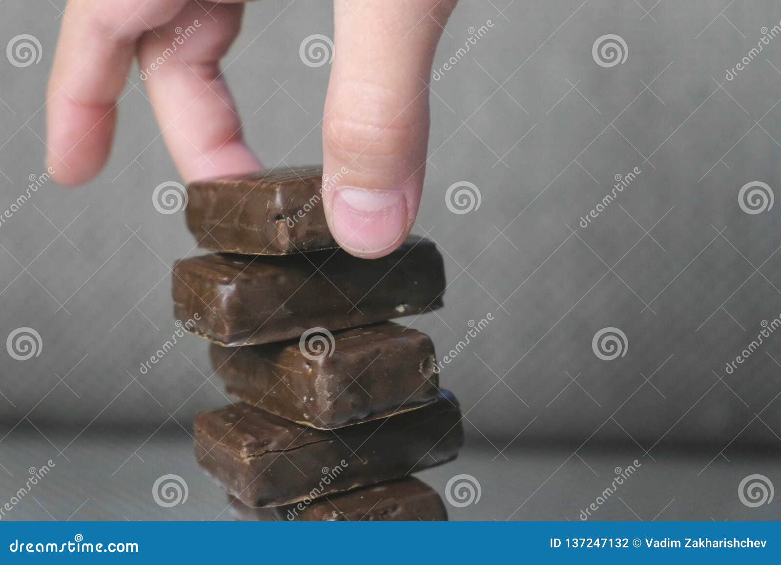 Hand Child Closeup Takes a Chocolate Candy. Stock Photo - Image of ...