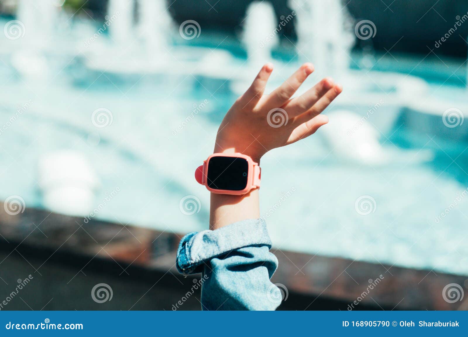 Hand of a Child with Pink Smart Watch Stock Photo - Image of ...