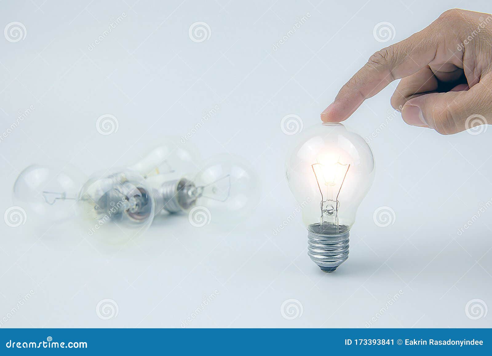 Hand Choose a Light Bulbs with Bright Light Concept for Creativity ...