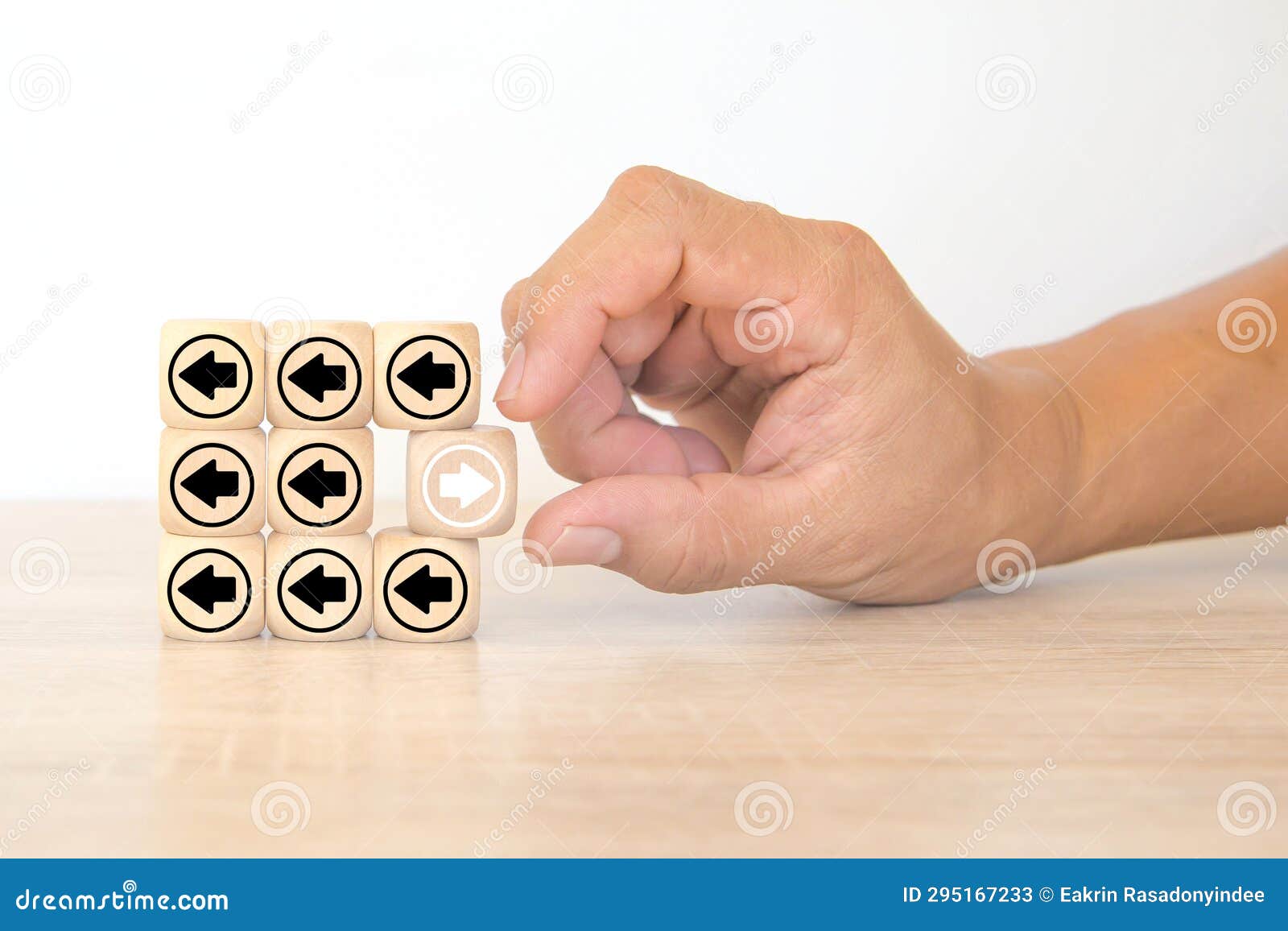 Hand Chooses Arrow Icon Point To the Opposite Side on Cube Wooden Block ...