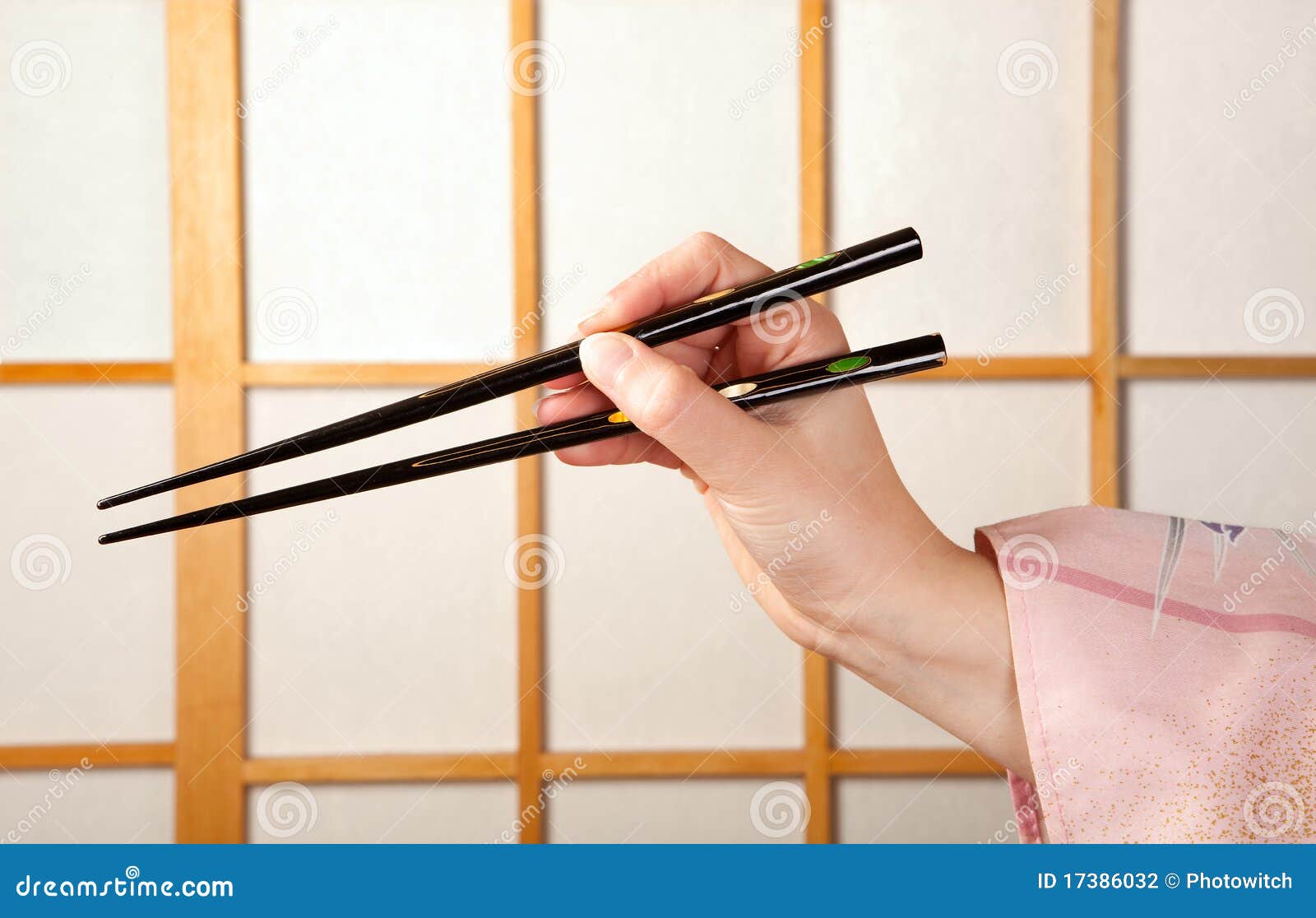 Hand with chopsticks stock photo. Image of sleeve, oriental - 17386032