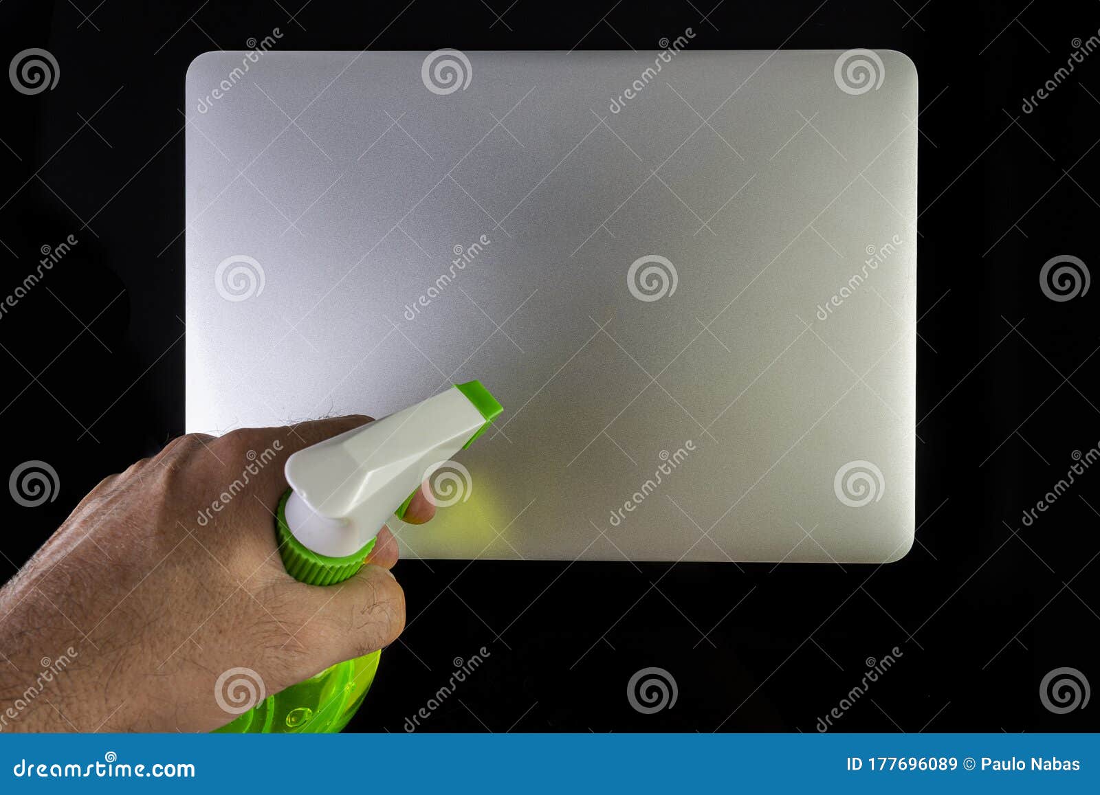 Hand Cleaning a Laptop with a Spray Bottle Sanitizer Stock Image ...