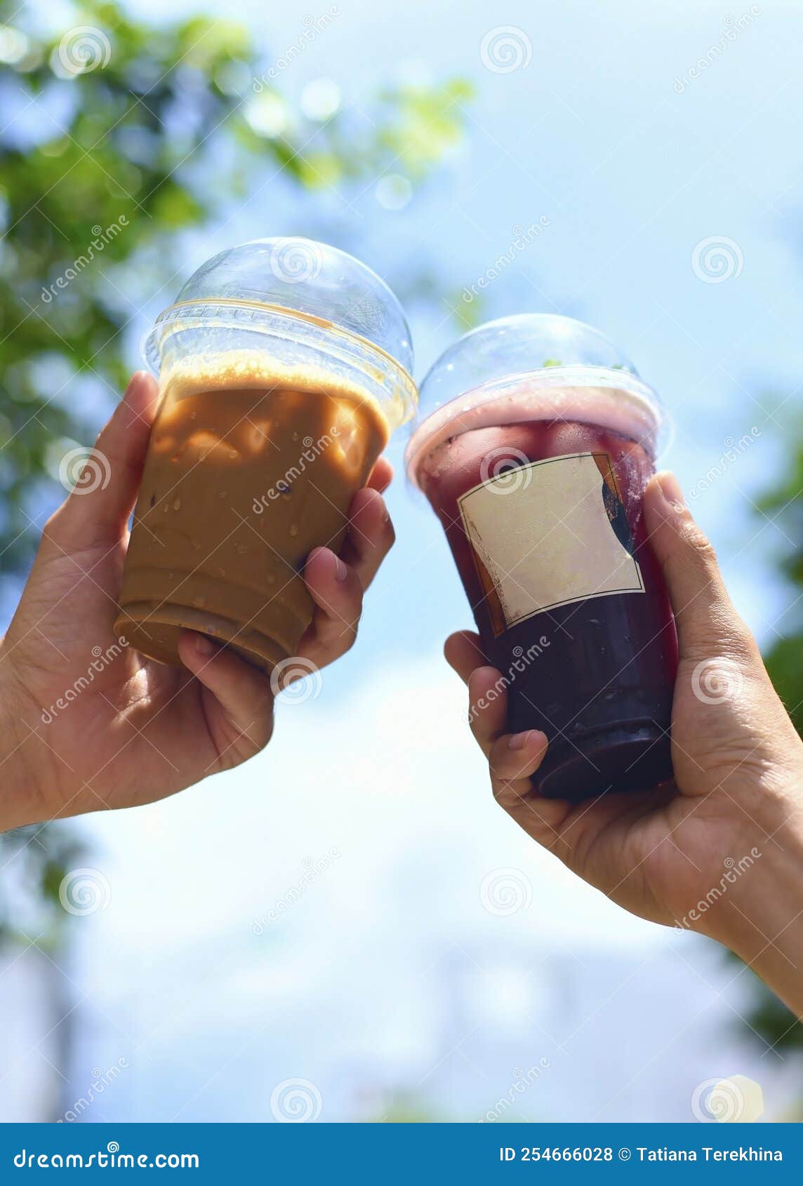 Hand Clinking Plastic Cups of Coffee and Mulberry Tea Closeup Stock ...