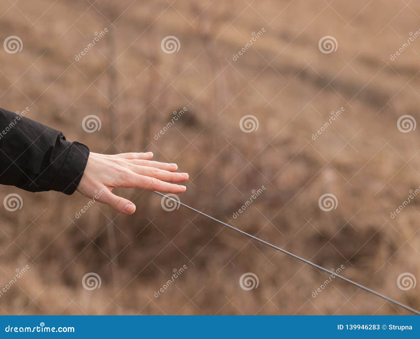 Hand Close To Wire of Electric Fence Stock Image - Image of instruction ...