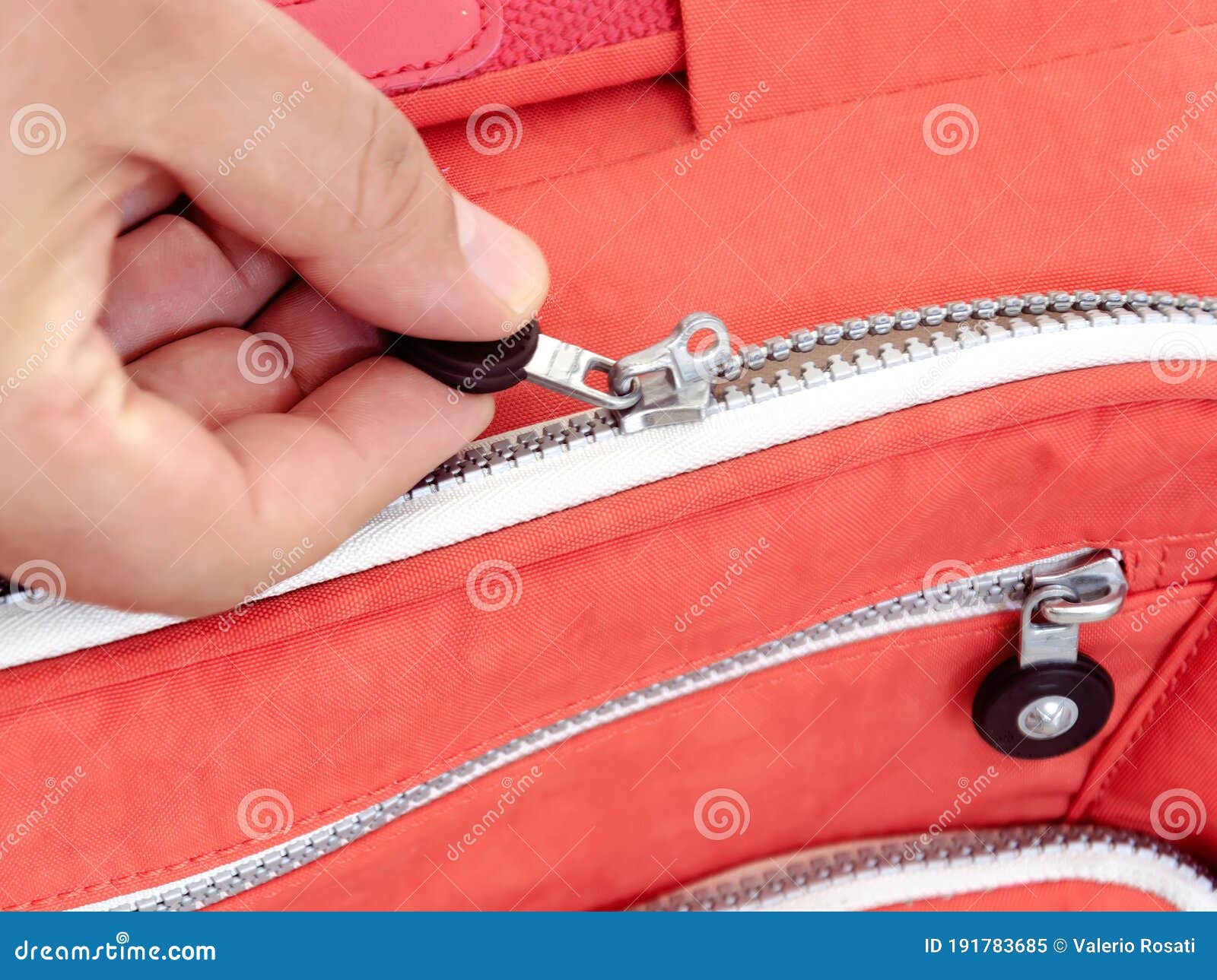 A Hand Closing a Red Suitcase Using a Zipper Stock Image - Image of ...